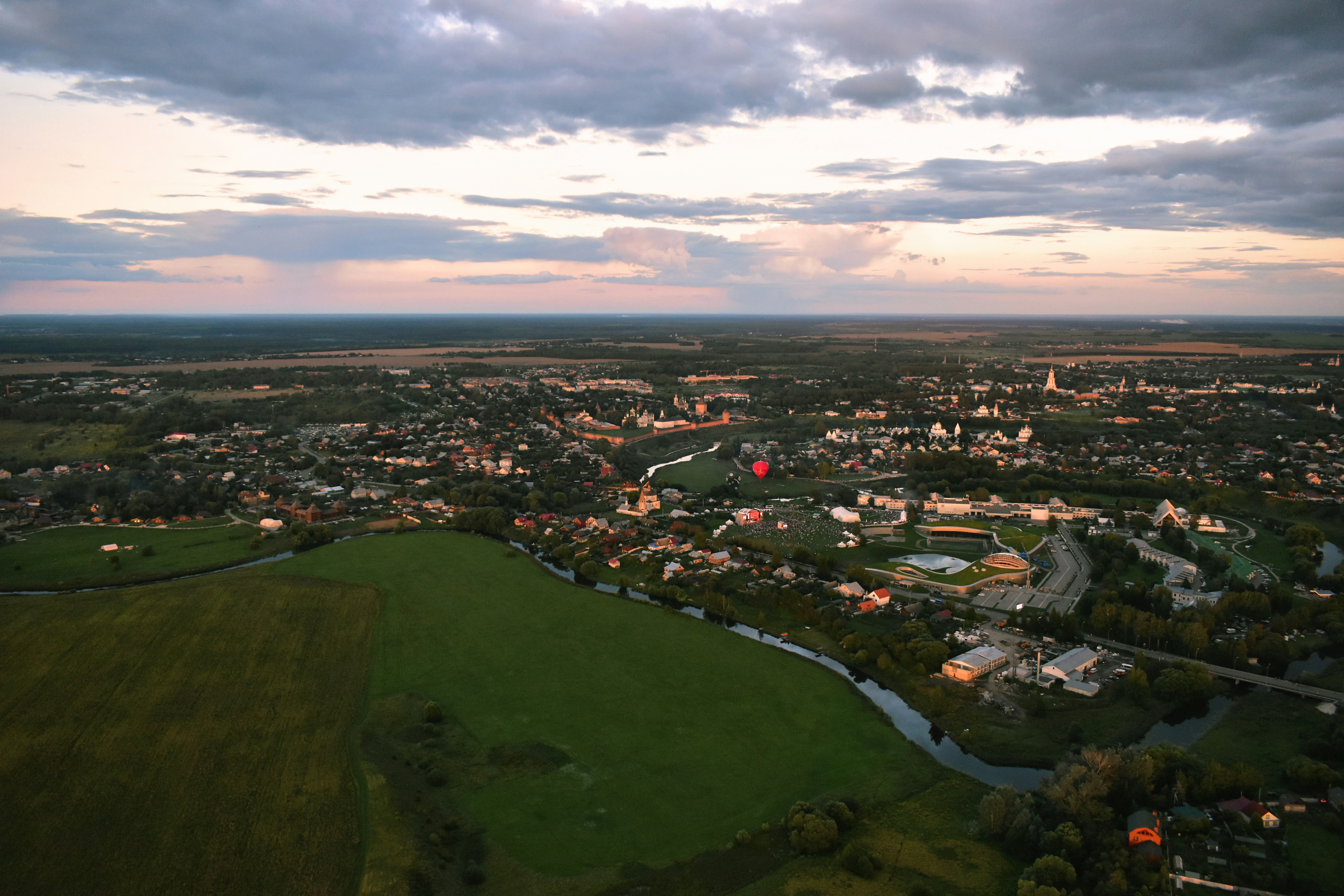 Red Pin over a Patchwork Townscape at Dusk