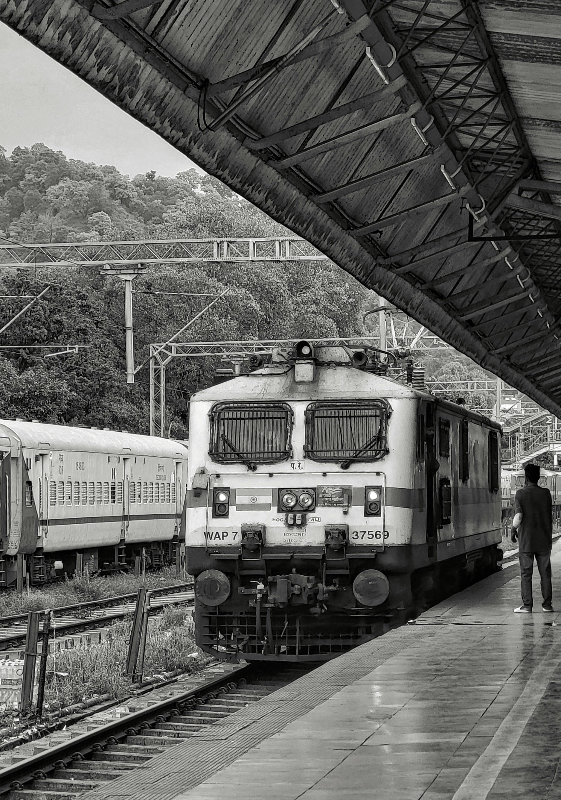 A couple of trains that are next to each other photo – Free Train Image ...