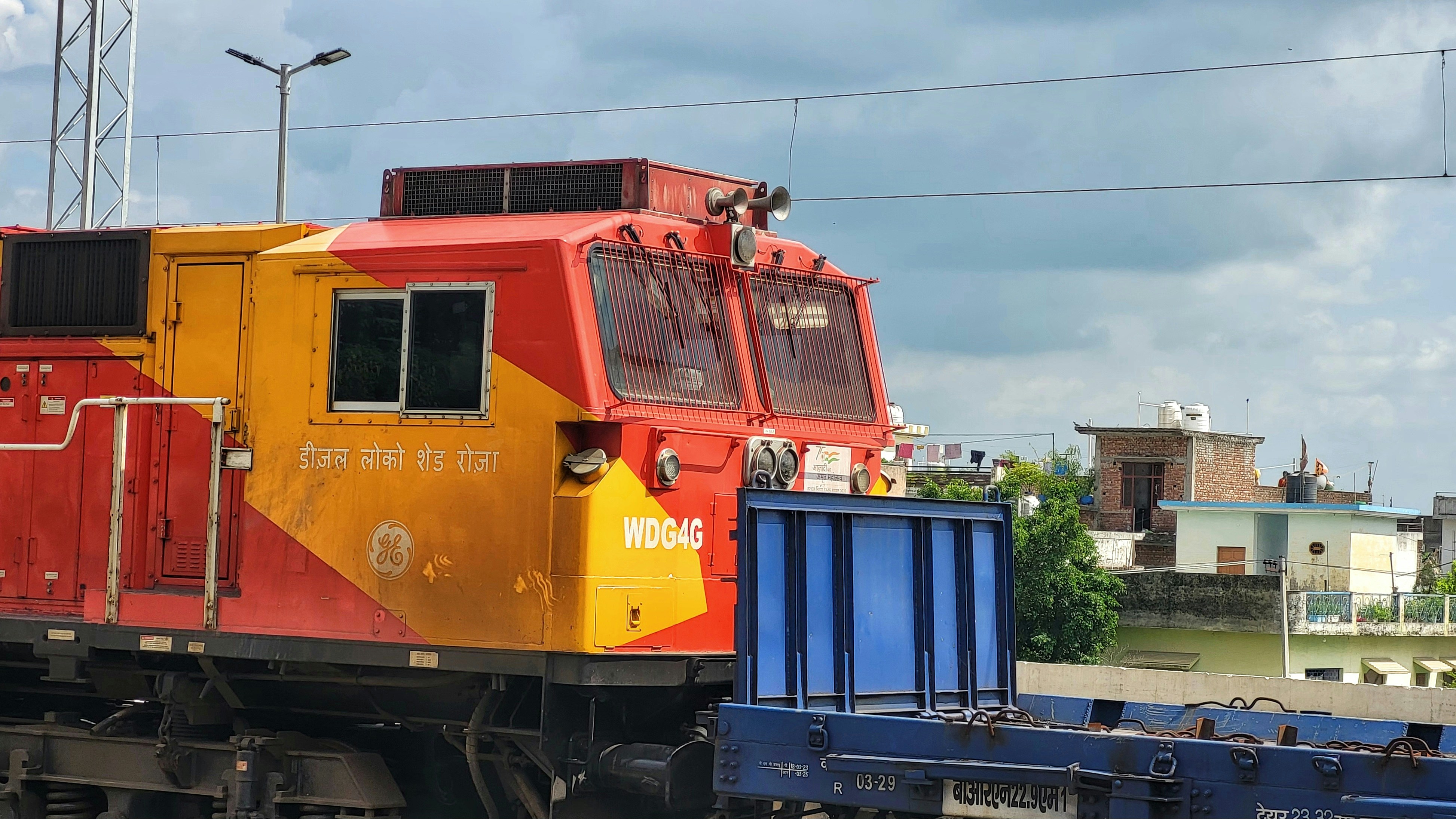 A red and yellow train traveling down train tracks photo – Free Rail ...