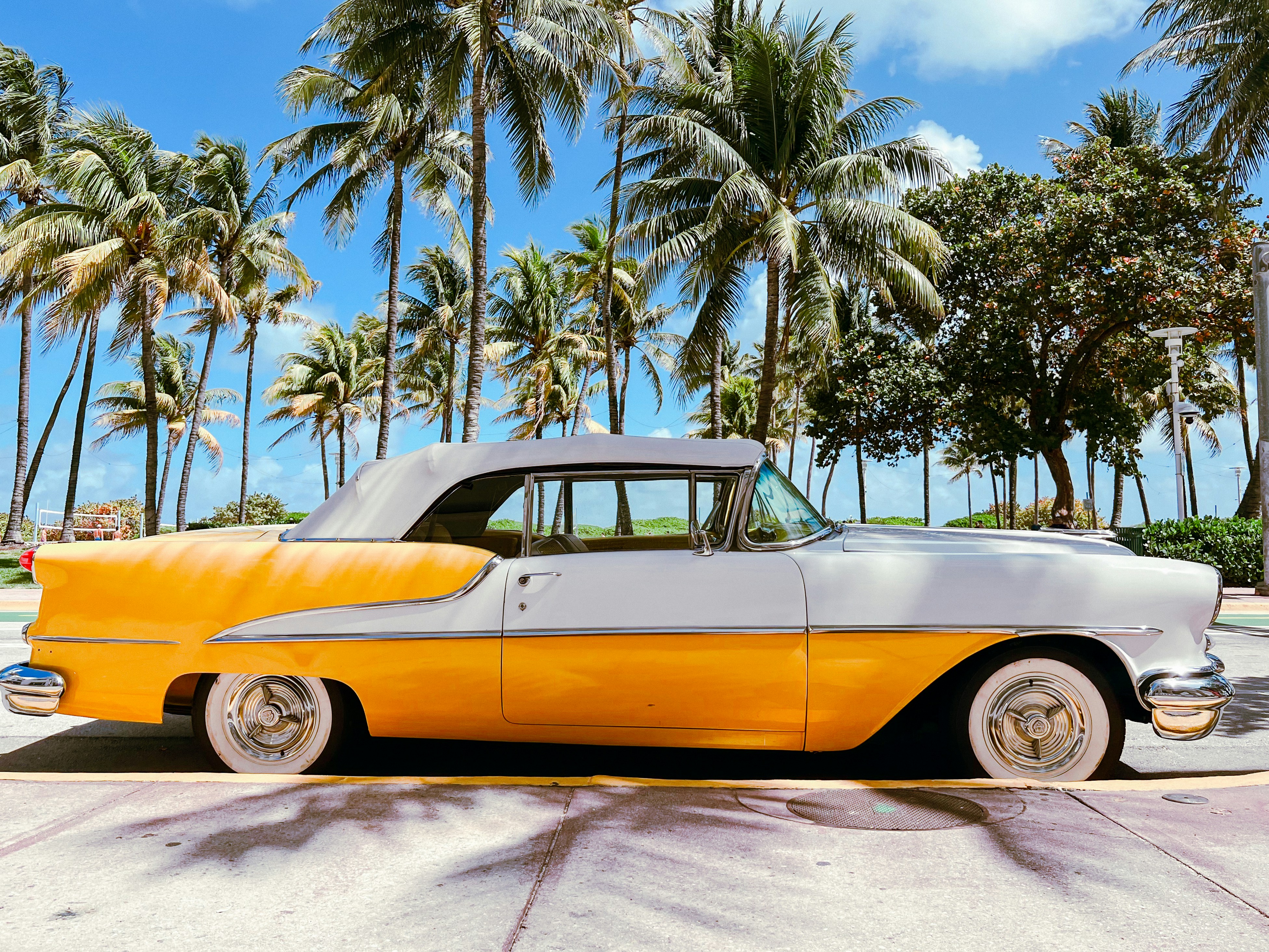 Cruising Through Time: A Vintage Convertible in Paradise