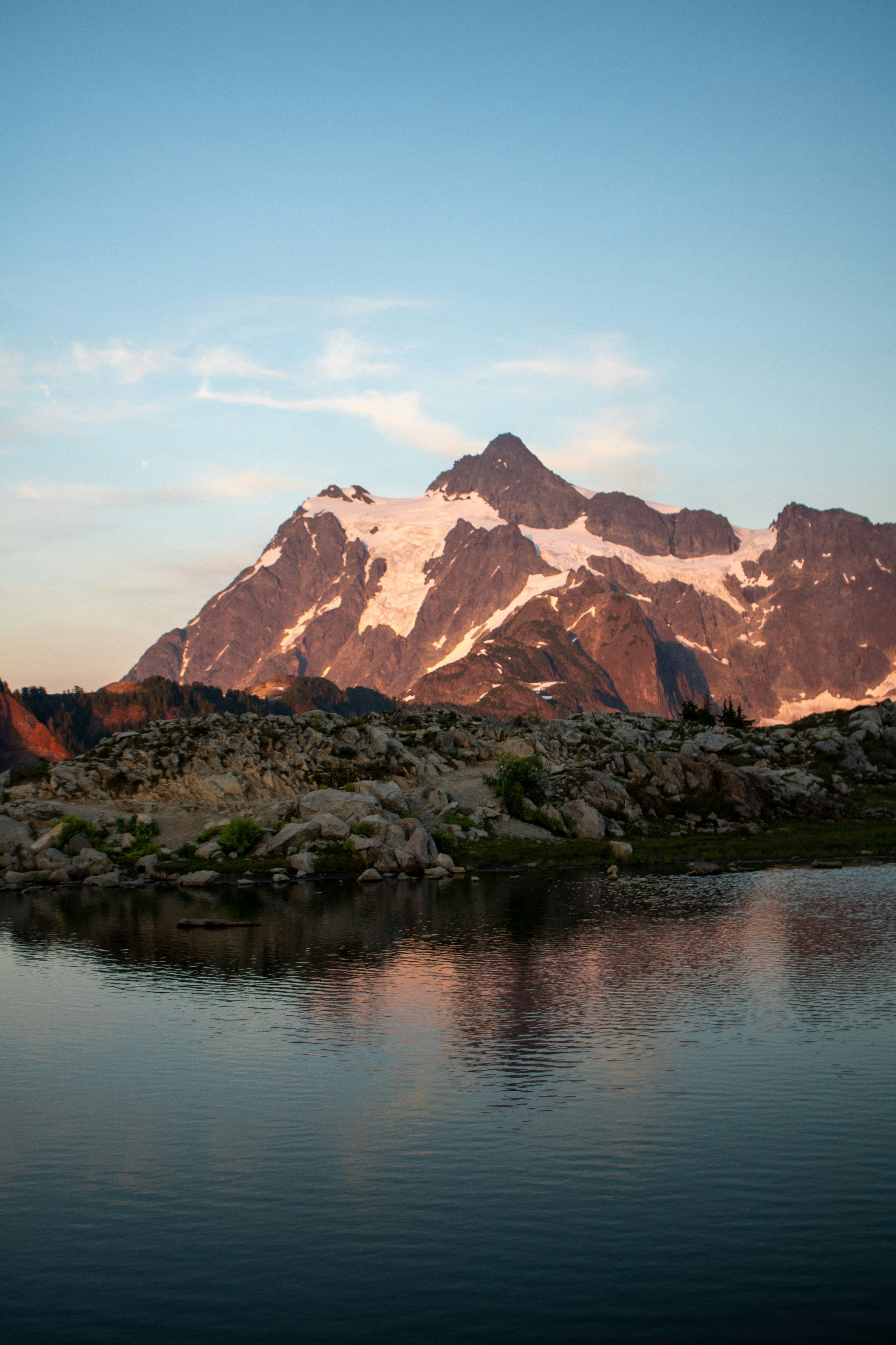 A mountain range with a lake in the foreground photo – Free Huntoon ...