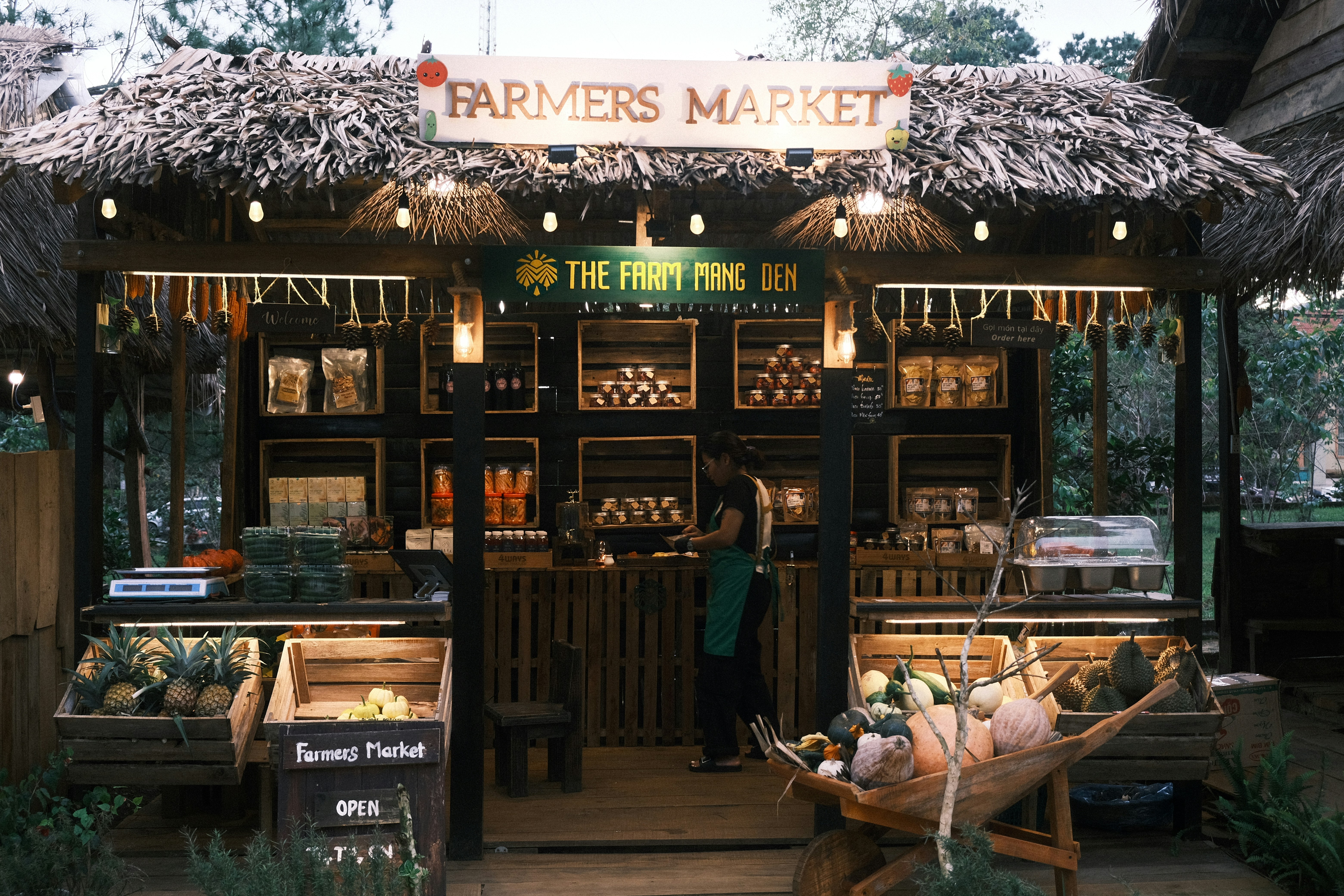 Twilight Market Stall Under a Thatch Roof: Warm Lanterns, Fresh Produce
