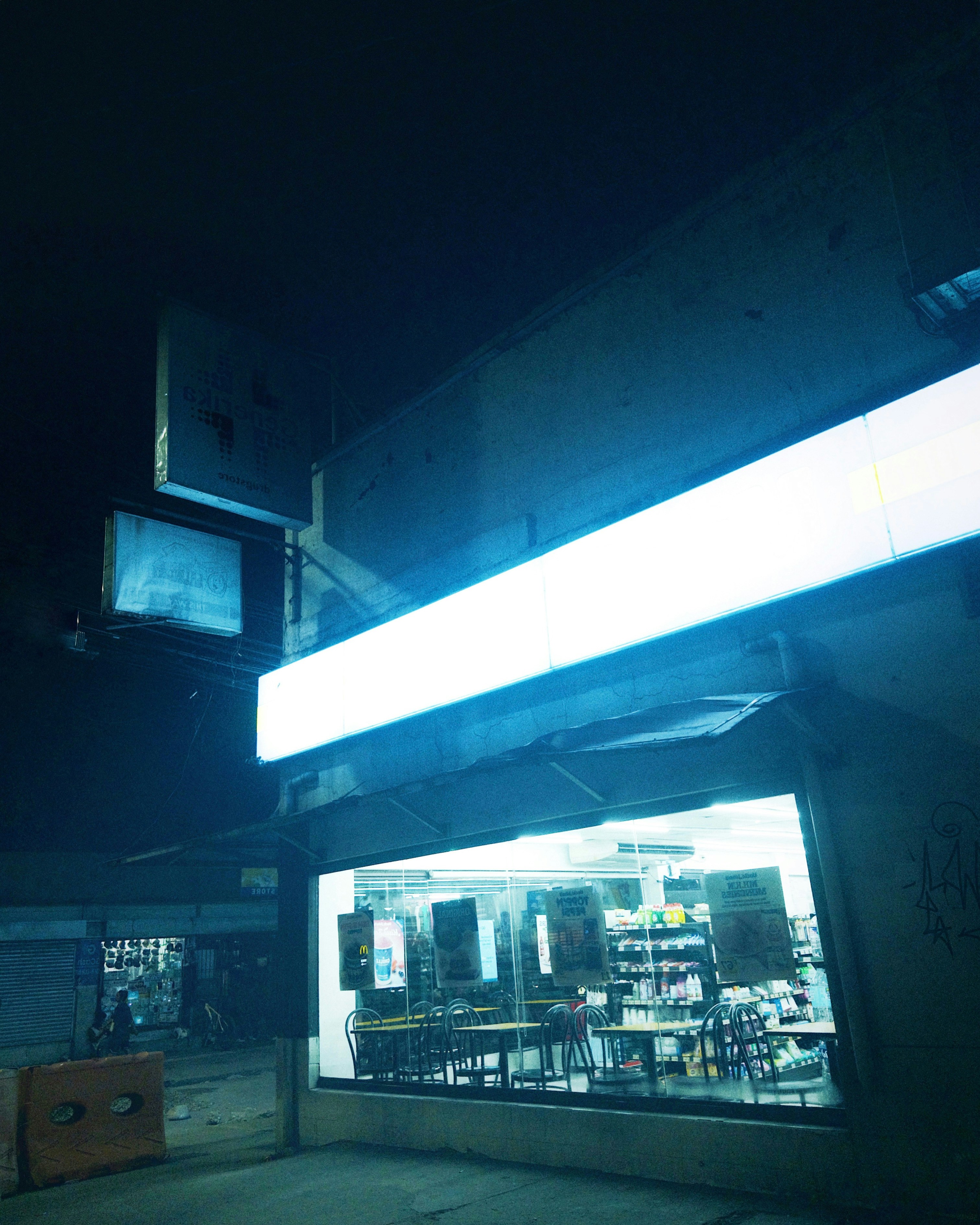 A store front at night with the lights on photo – Free City Image on ...
