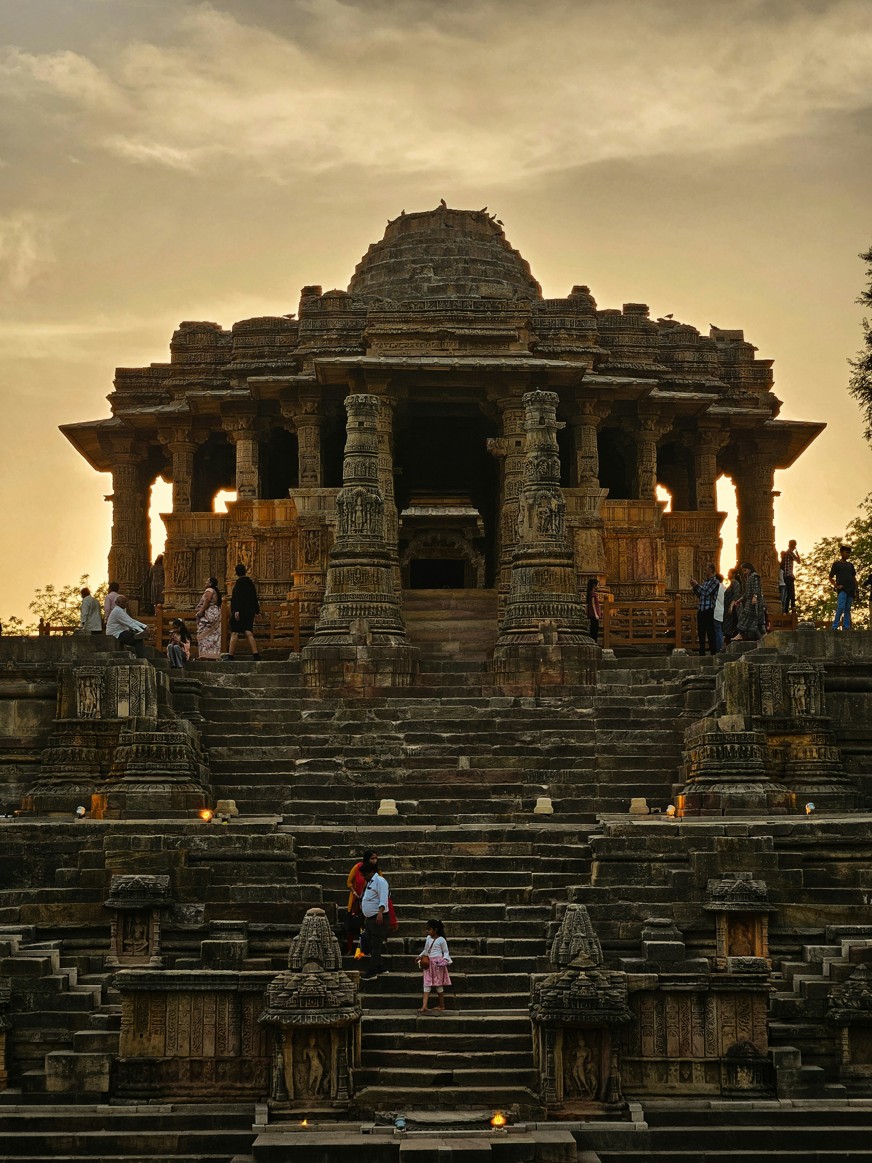 A group of people standing on top of a stone structure