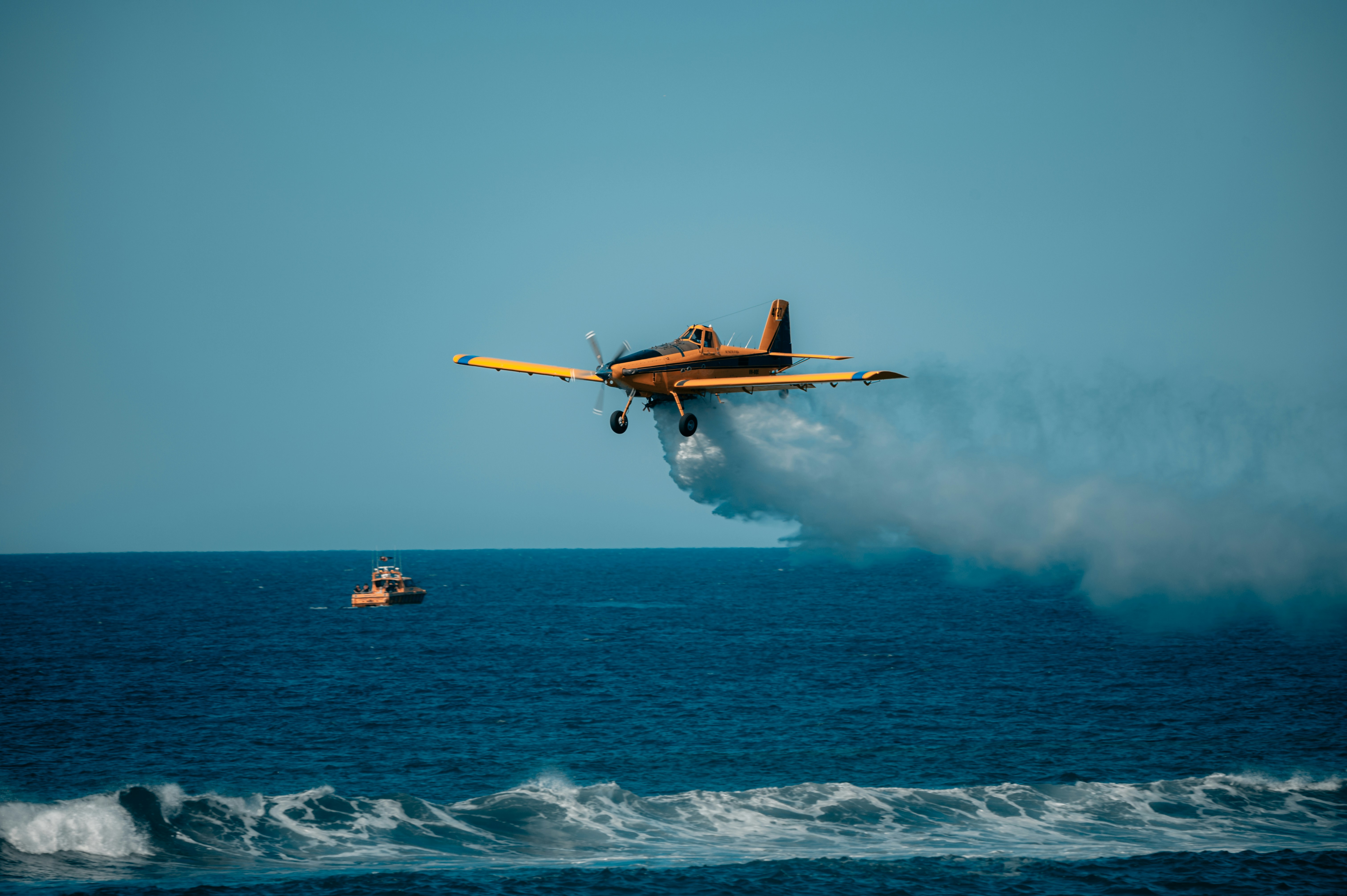 A plane flying over a body of water photo – Free Surfers paradise qld ...