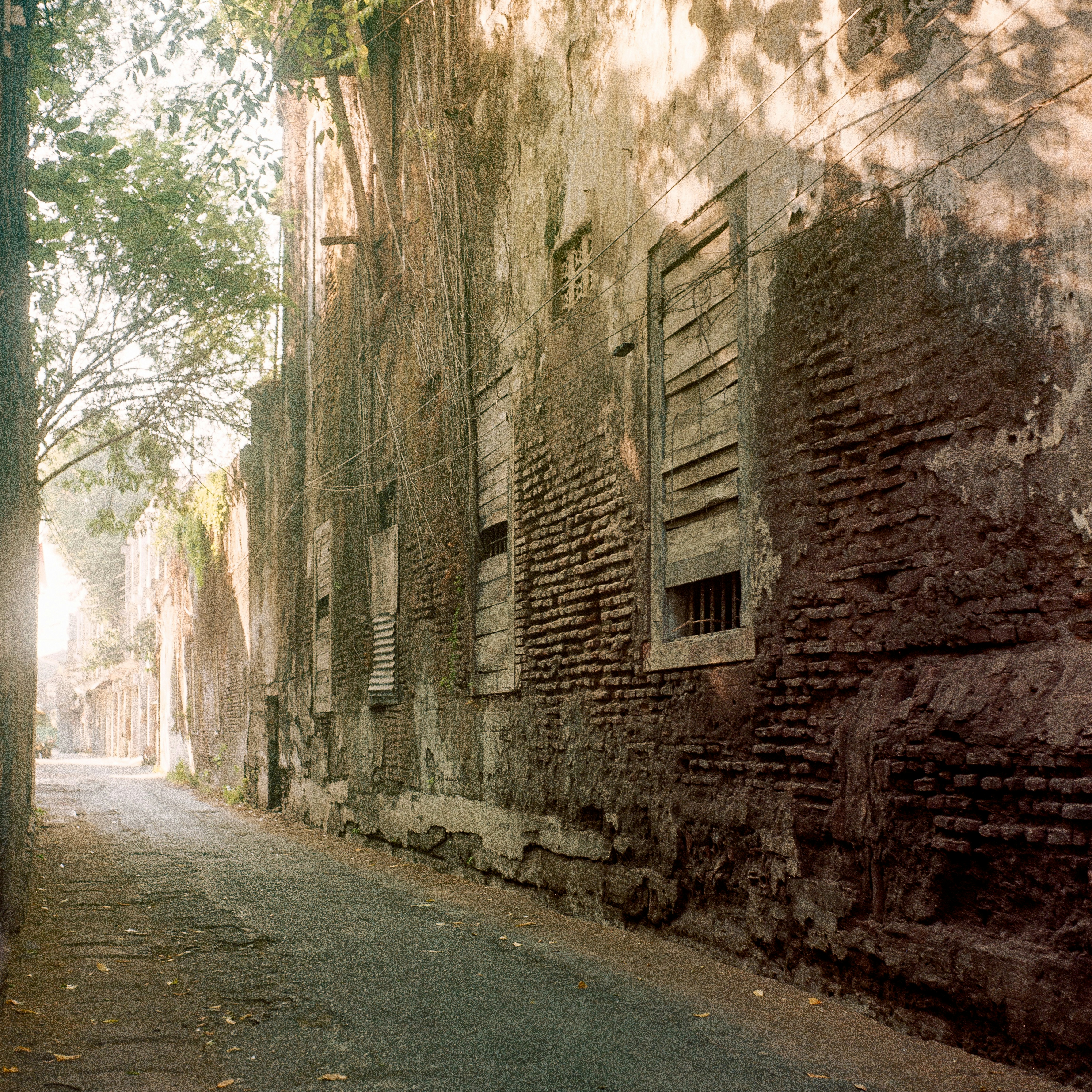 Sunlit Echoes Along a Weathered Brick Alley