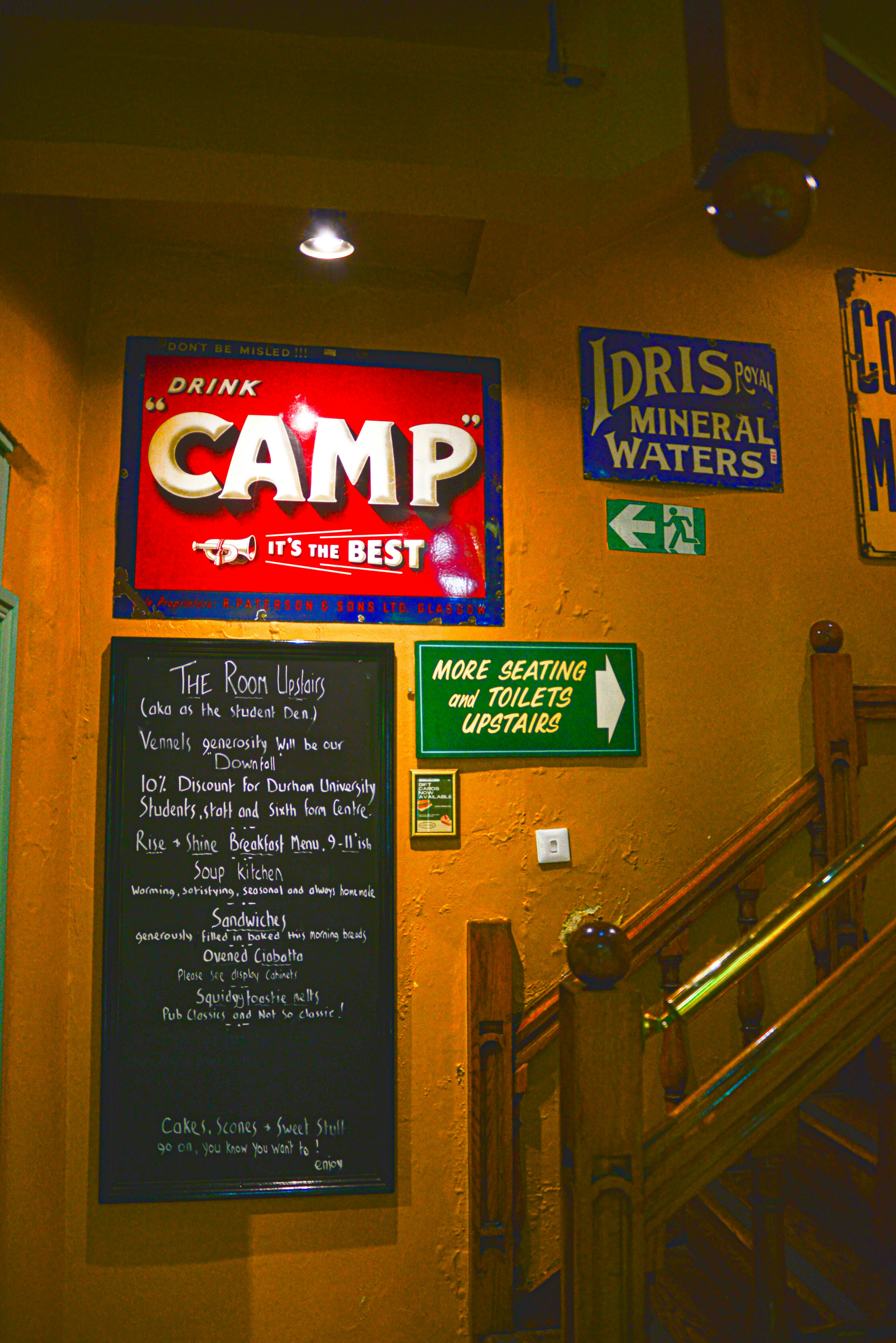 Lively Signage and Staircase in a Cozy Eatery