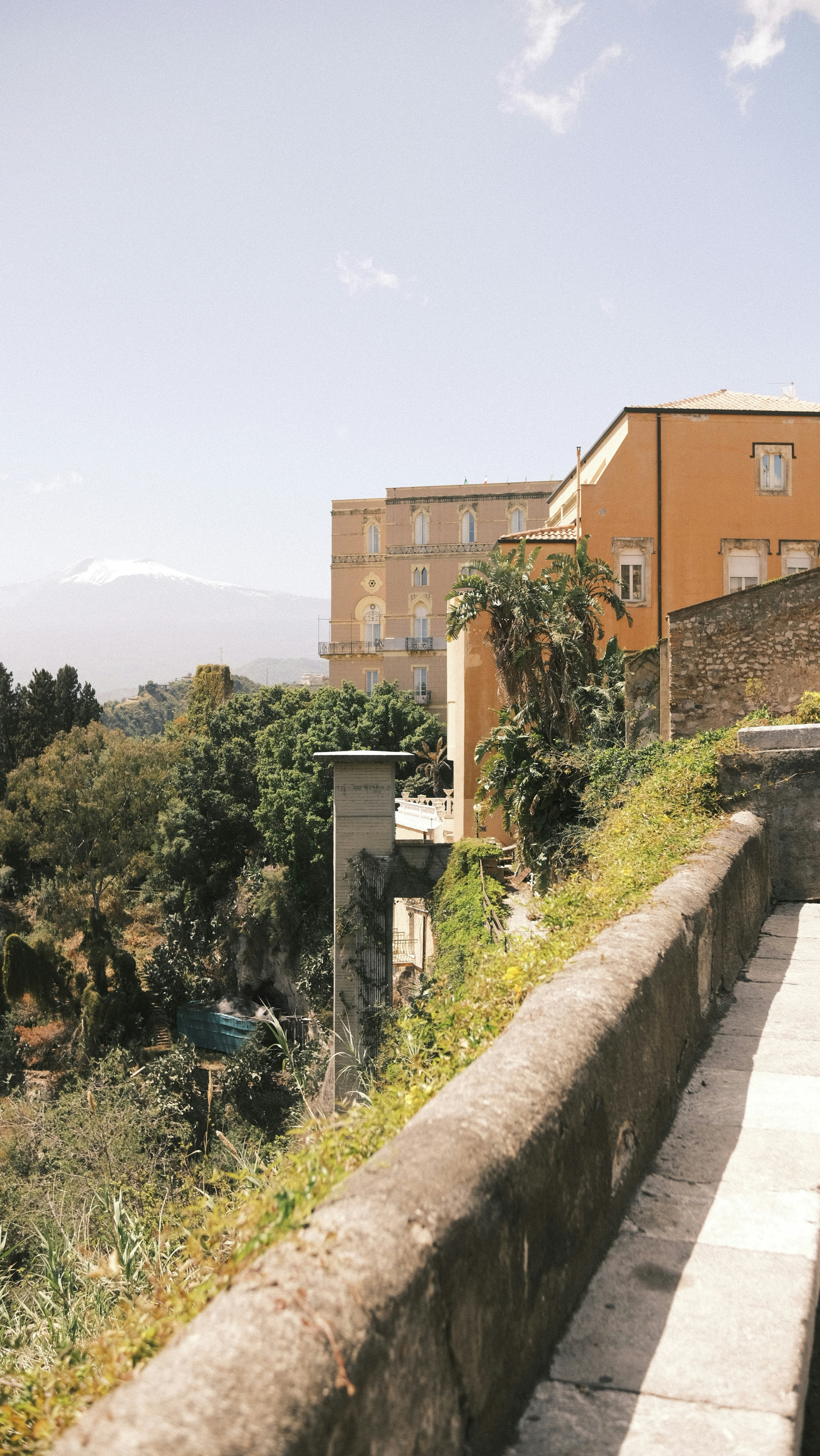 Terracotta Terrace: A Sunlit Promenade Beneath Orange Facades