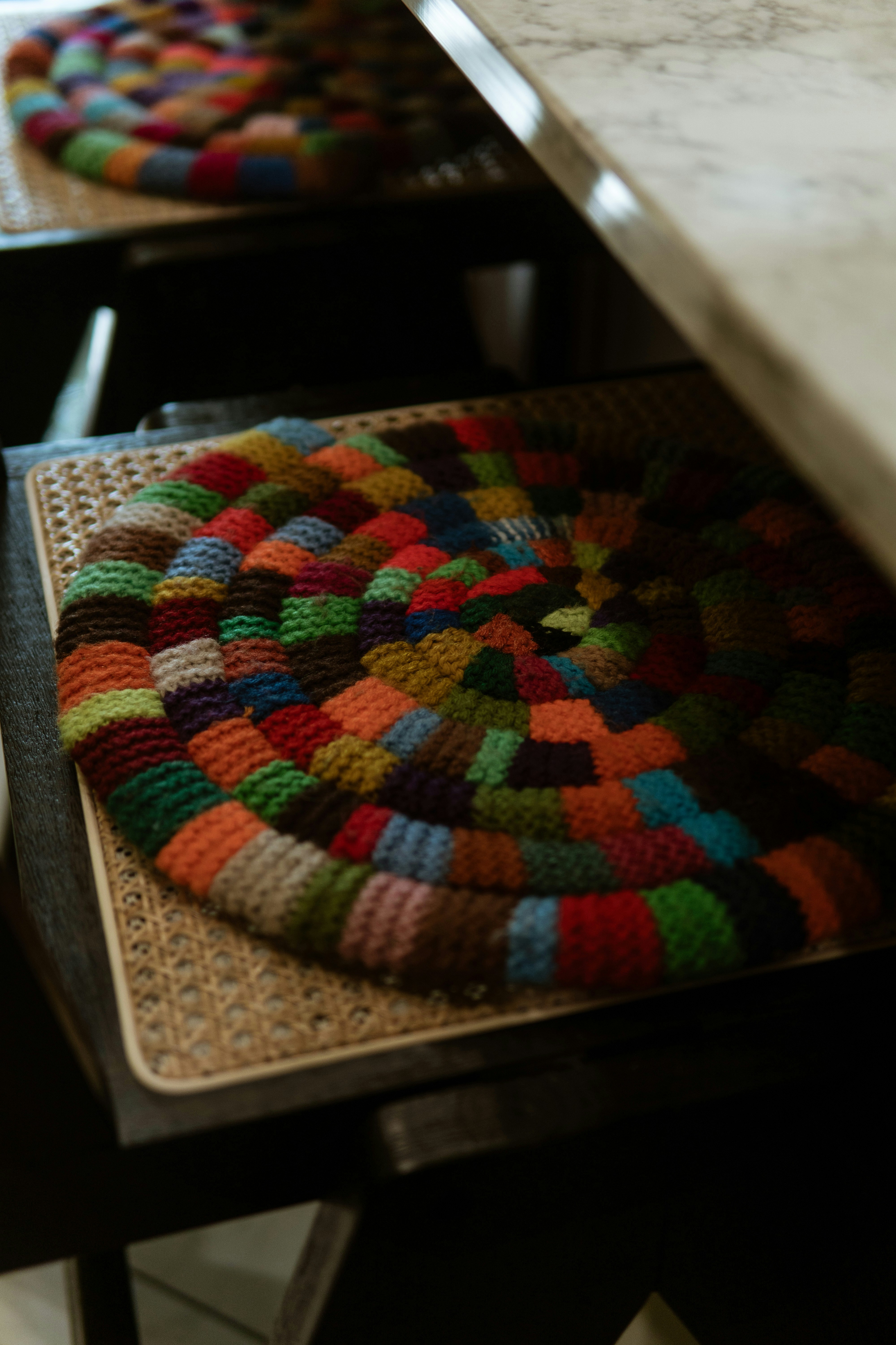 Under the Edge: A Crochet Color Wheel on a Woven Mat