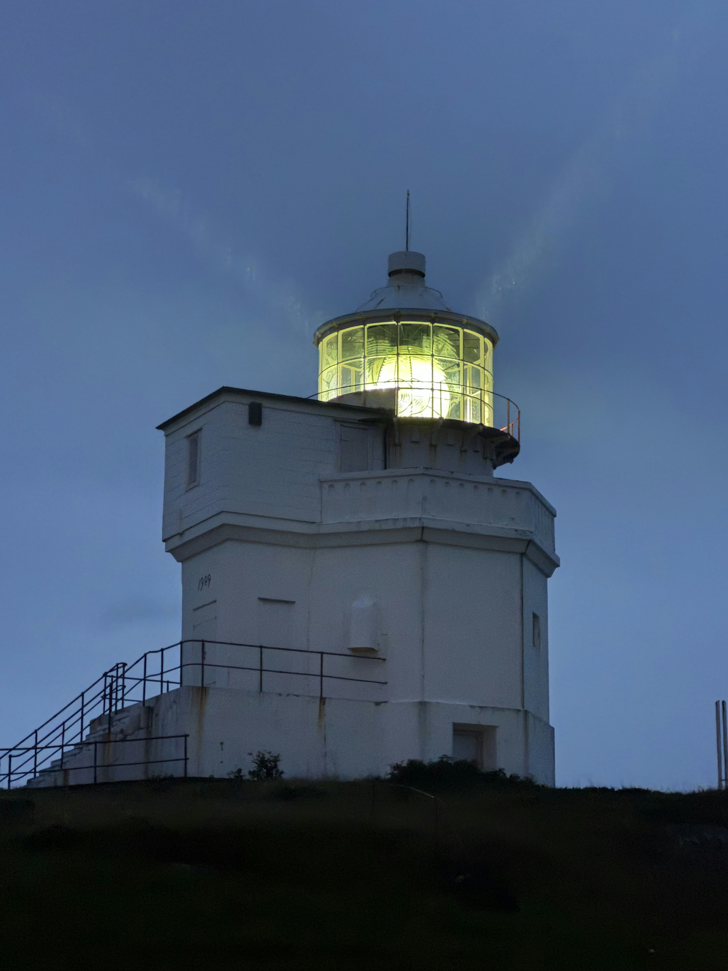 A white light house sitting on top of a hill photo – Free Lighthouses ...