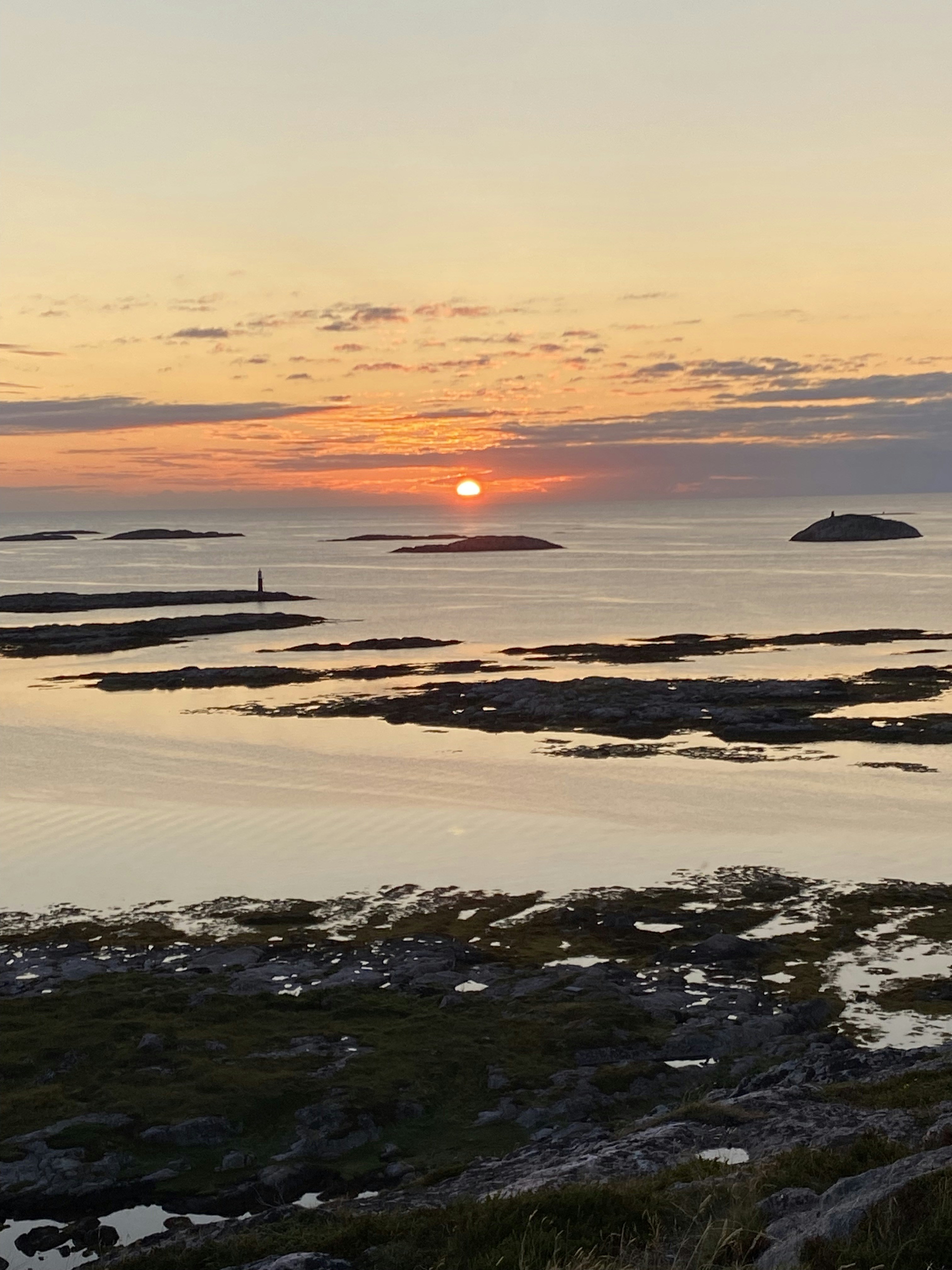 Sun on the Quiet Horizon: Tidal Flats Framed by Distant Islets