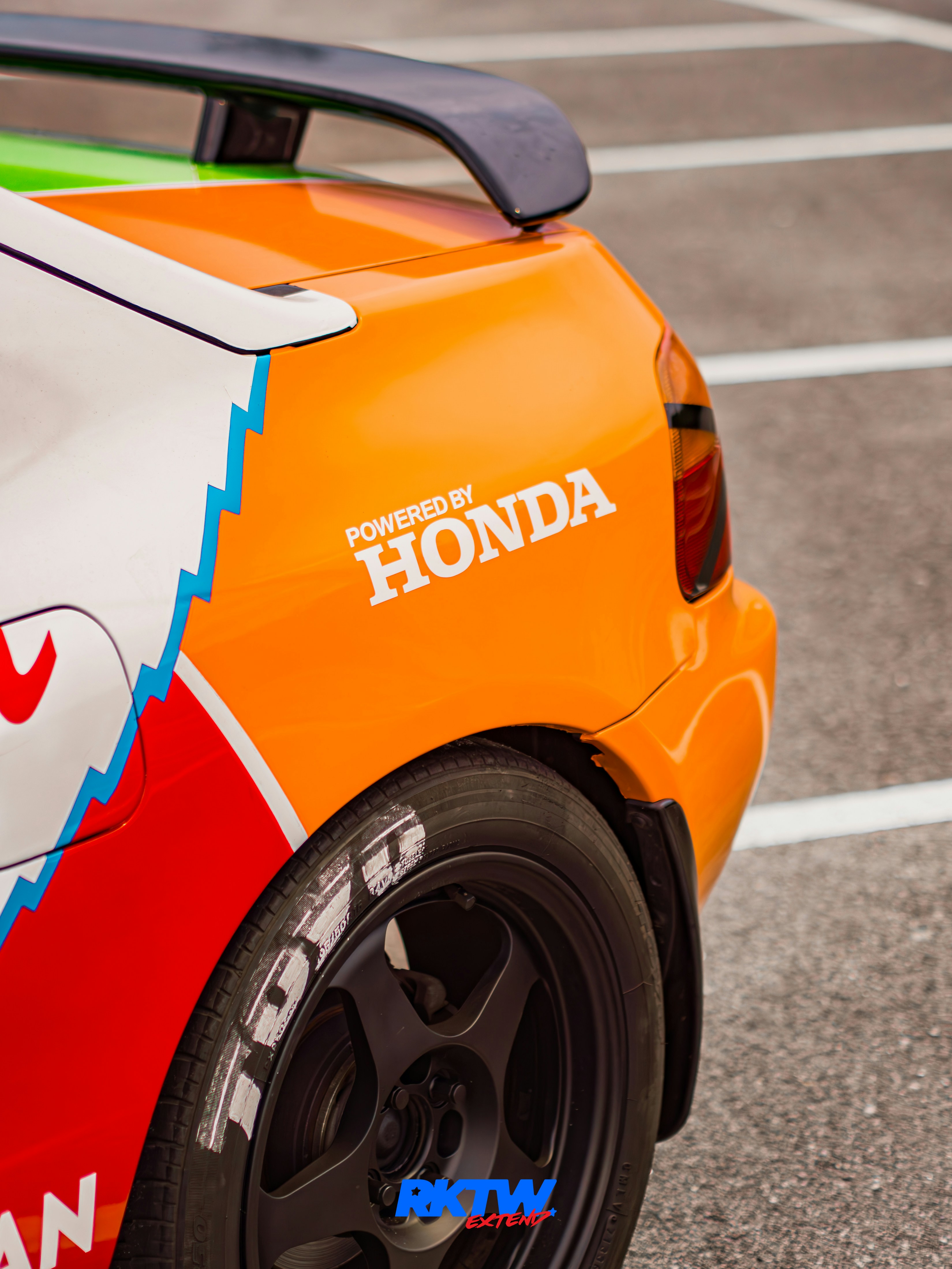 Powered by Honda: A Close-Up of Bold Racing Livery on a Track Car