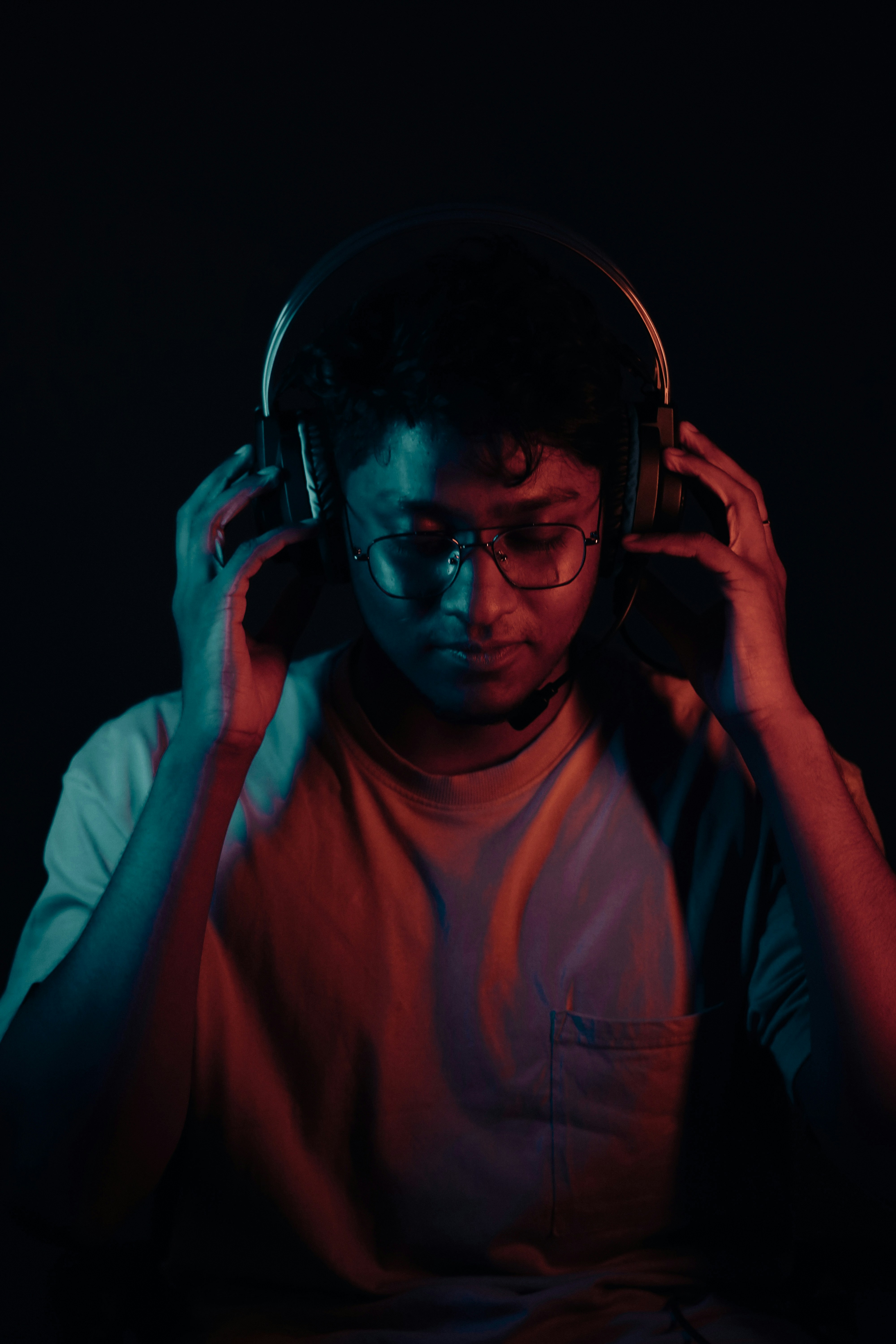 Neon Quietude: A Headphone Portrait in Blue and Crimson