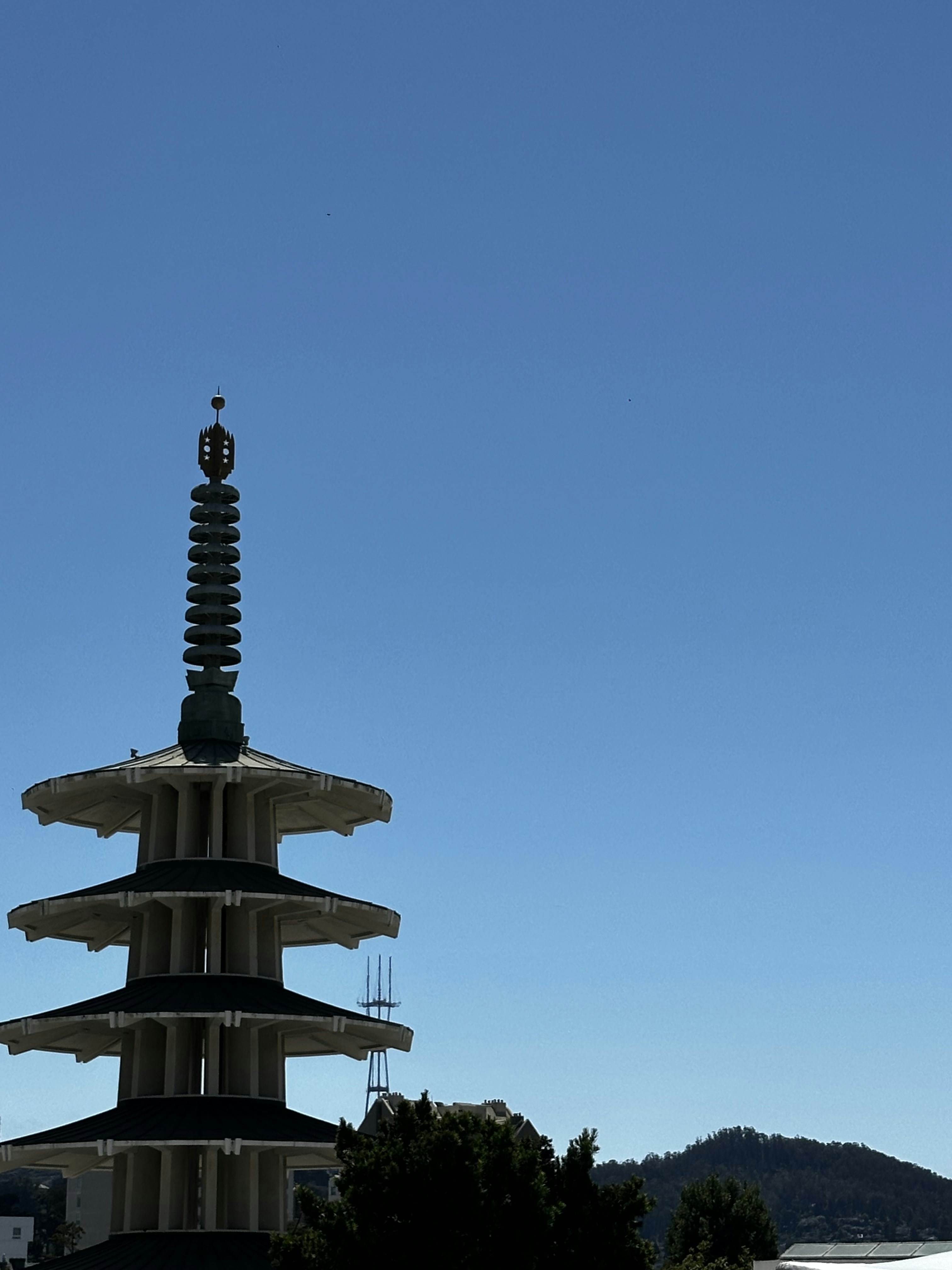 A tall tower with a clock on top of it