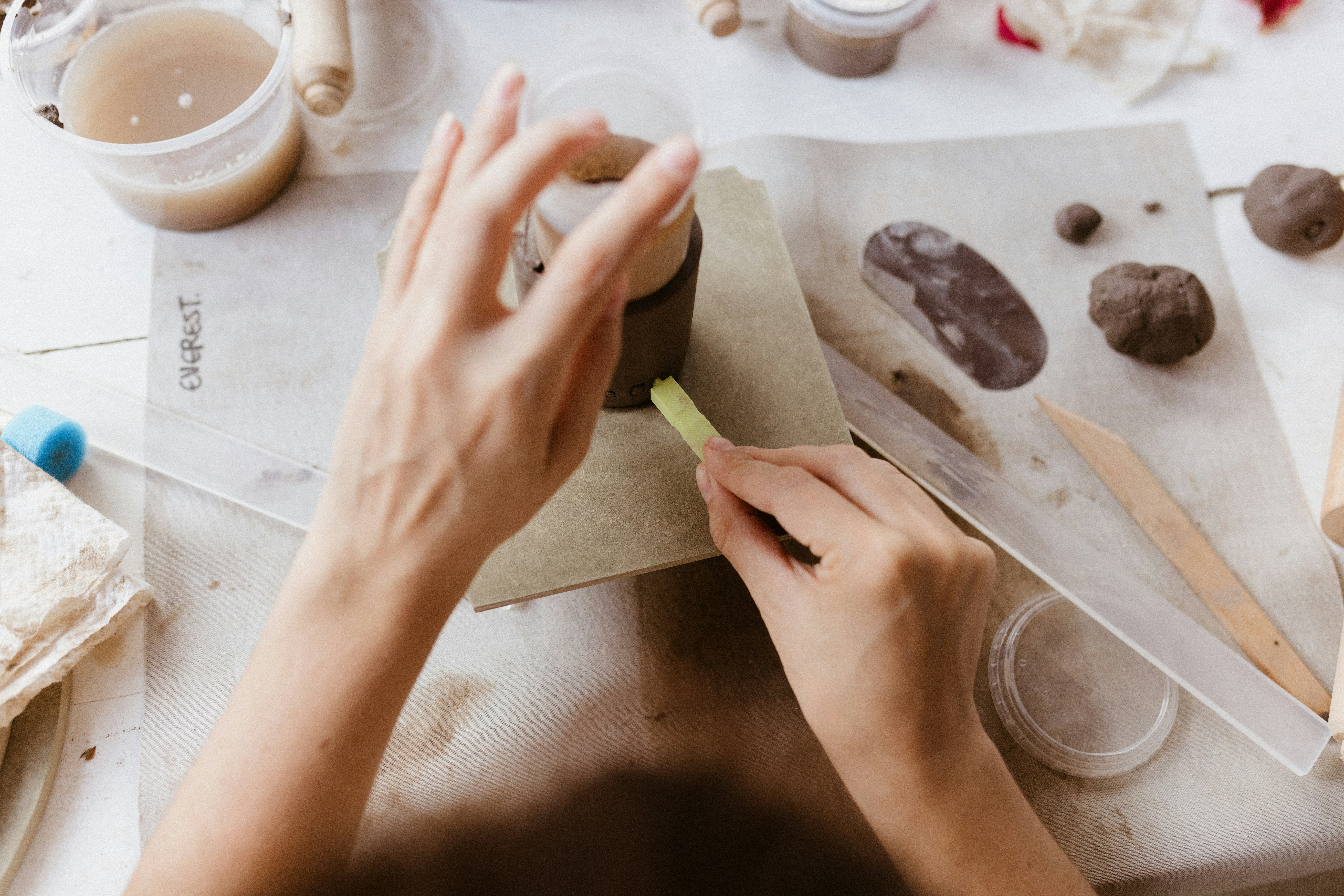 A woman is working on a craft project photo – Free Weapon Image on Unsplash