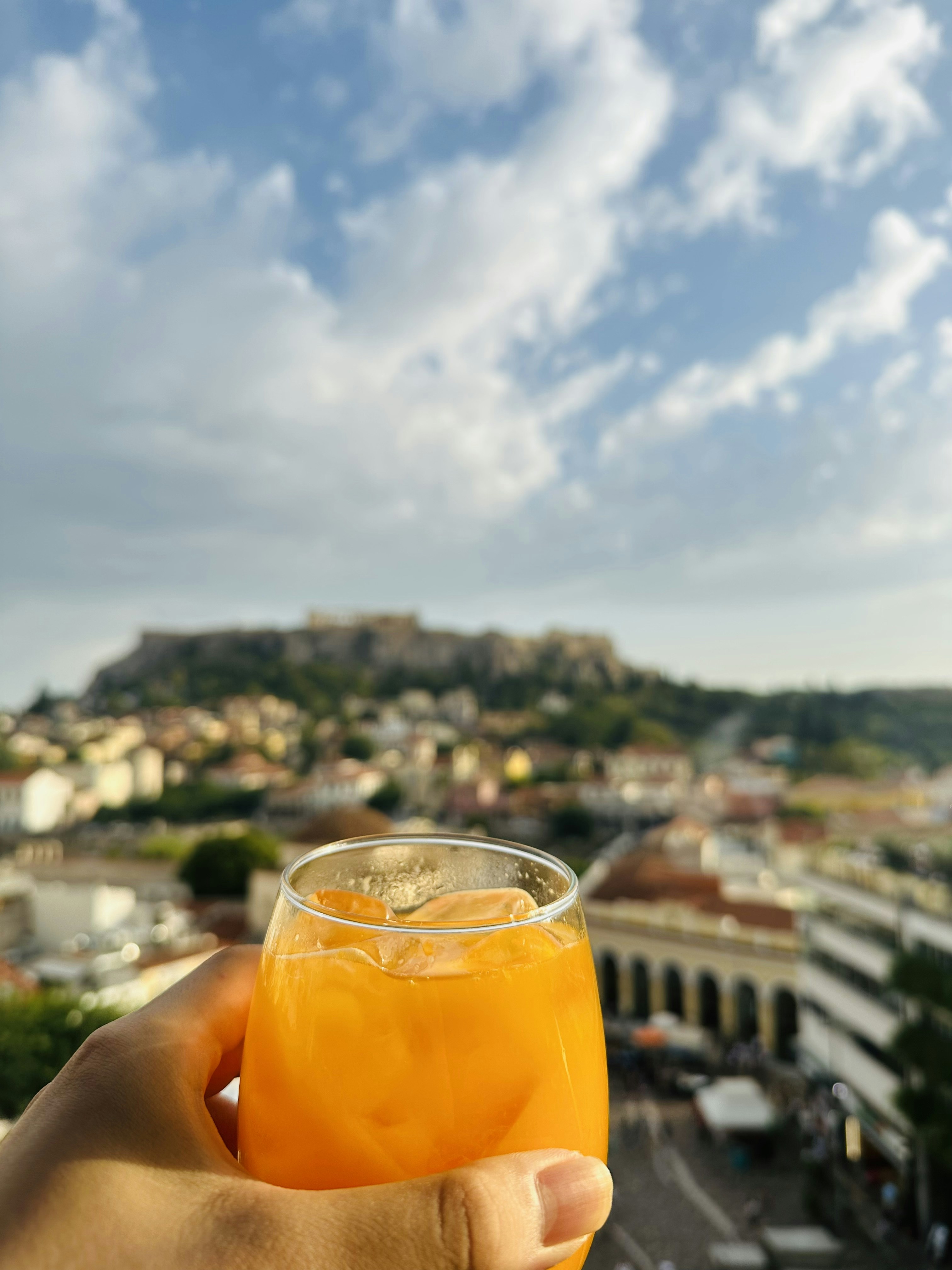 Citrus on the Terrace: A sunlit drink over a hilltop town and fortress