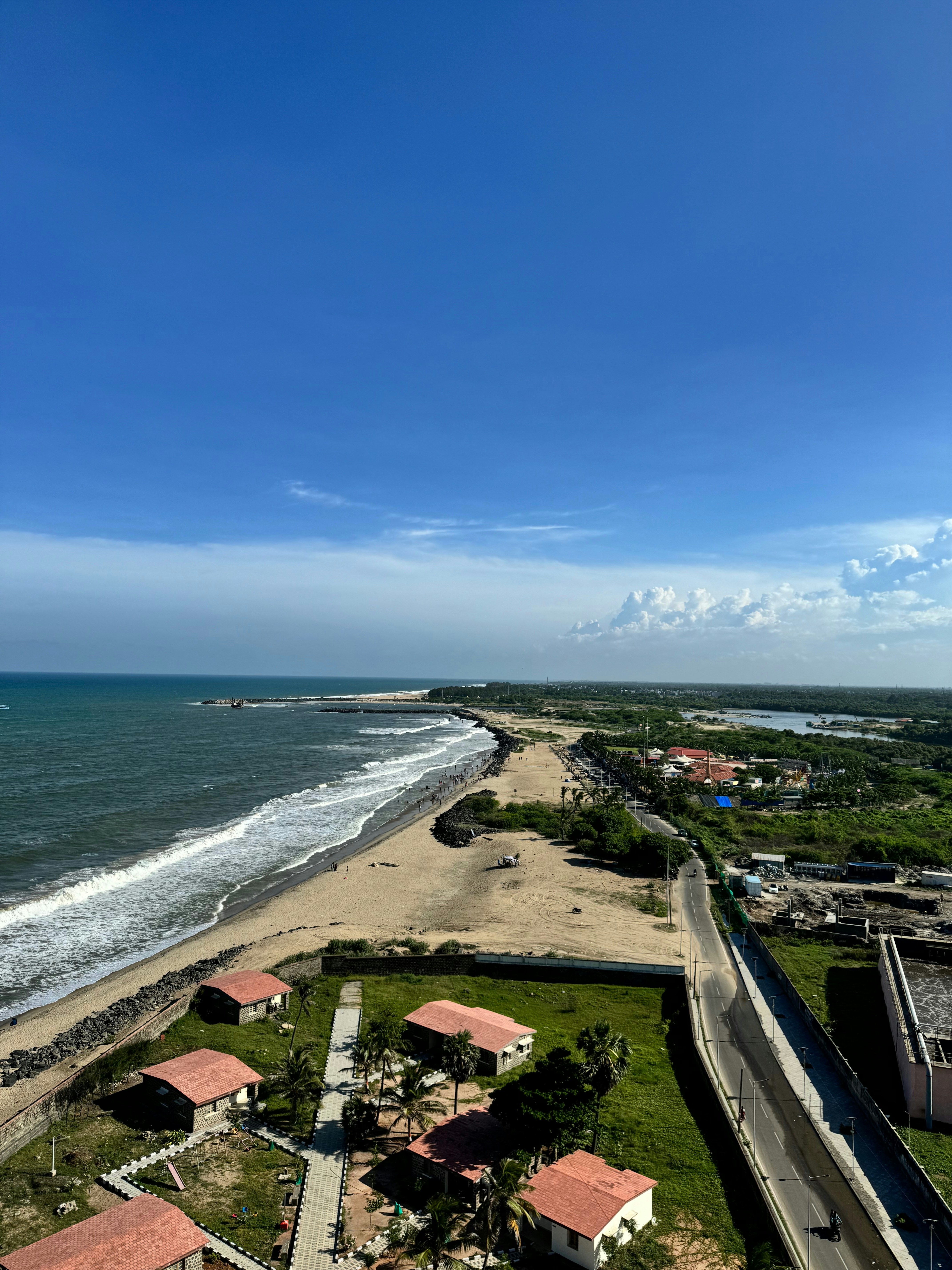 Coastal Ribbon: Red-Roofed Villages Along a Meandering Beach