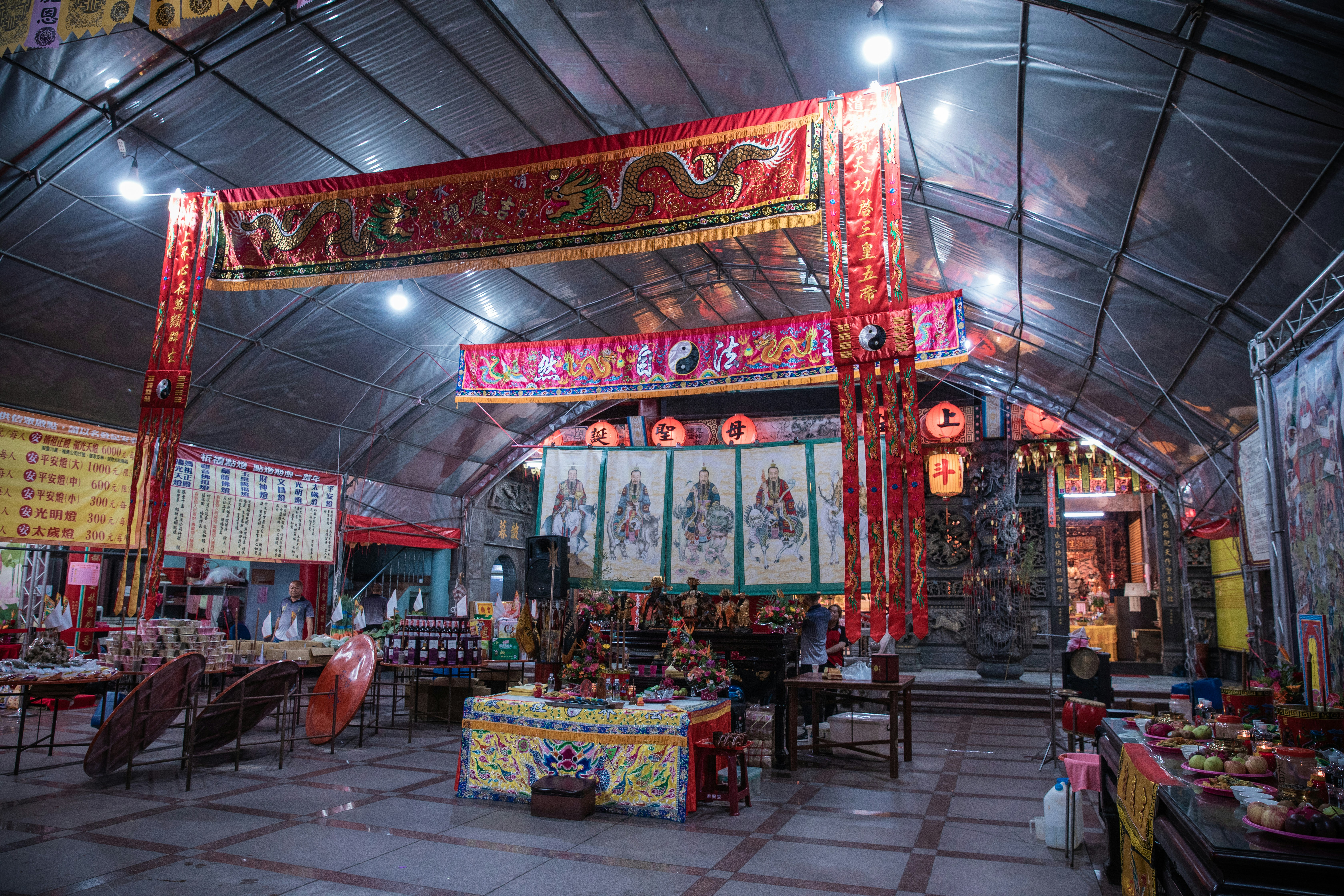 Lantern-lit Temple Market Beneath a Curved Steel Roof