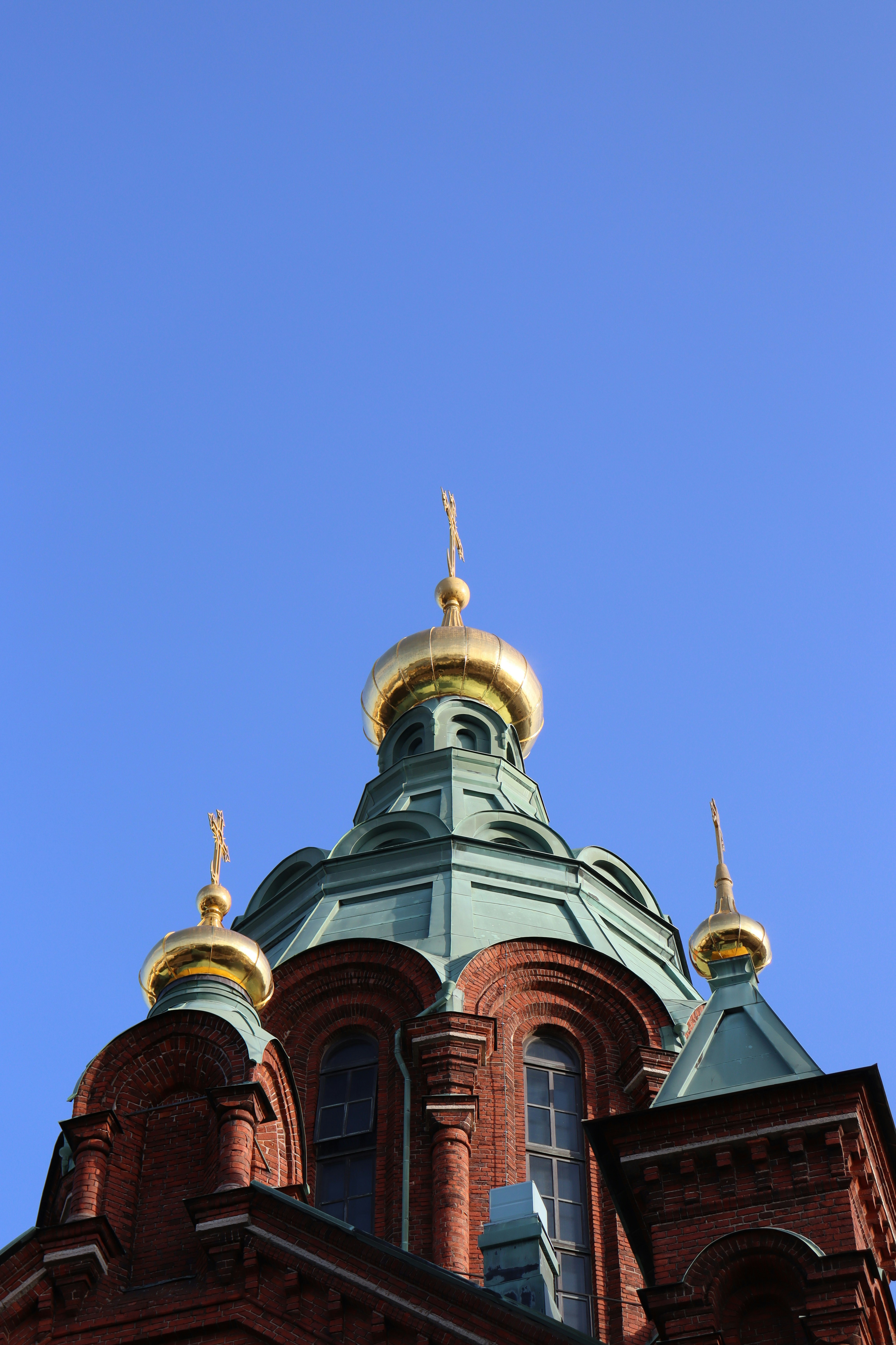 Azure Spire: The Gold-Crowned Dome Piercing a Pristine Blue