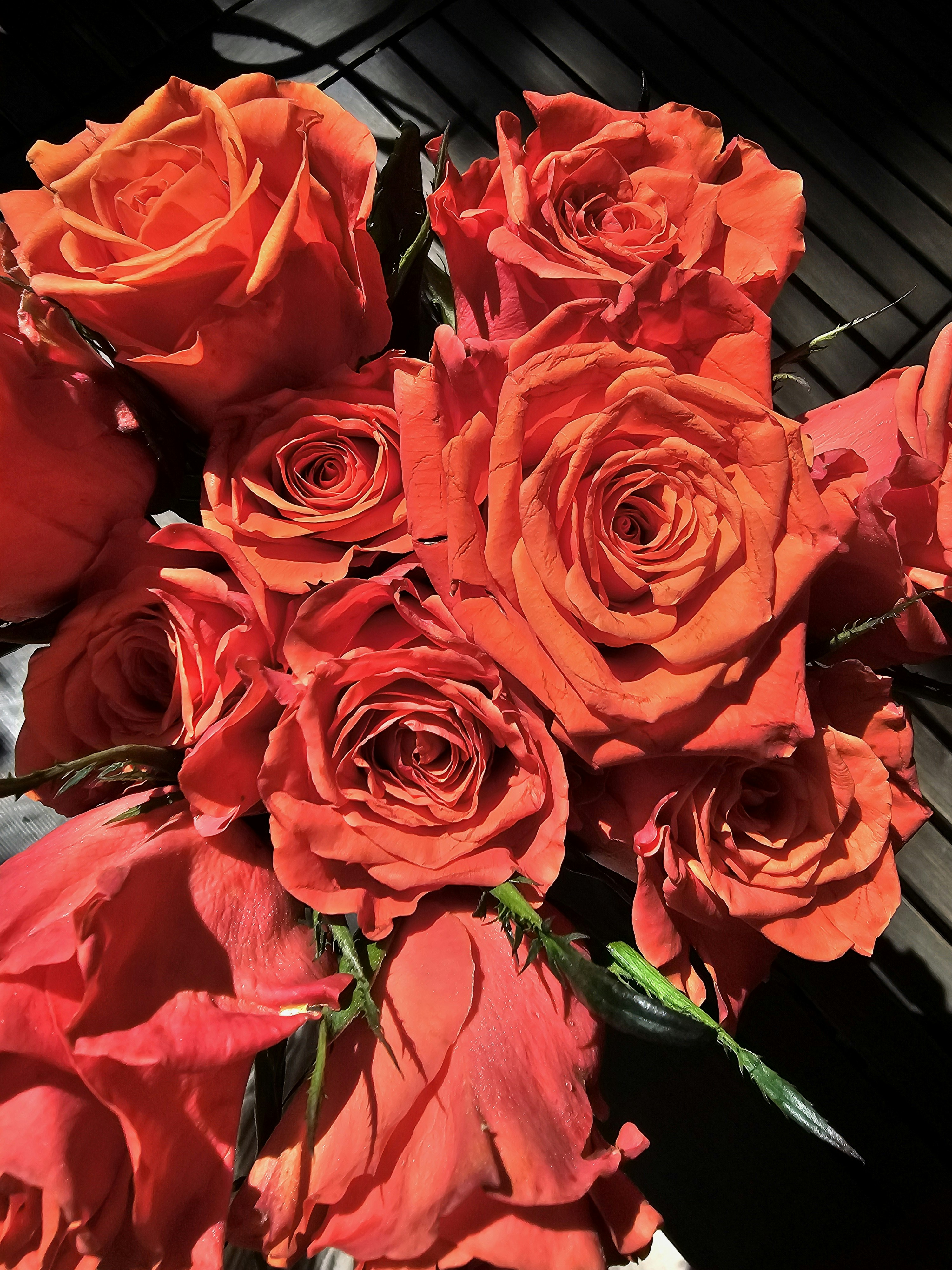 A bouquet of red roses sitting on top of a table photo – Free Rose ...