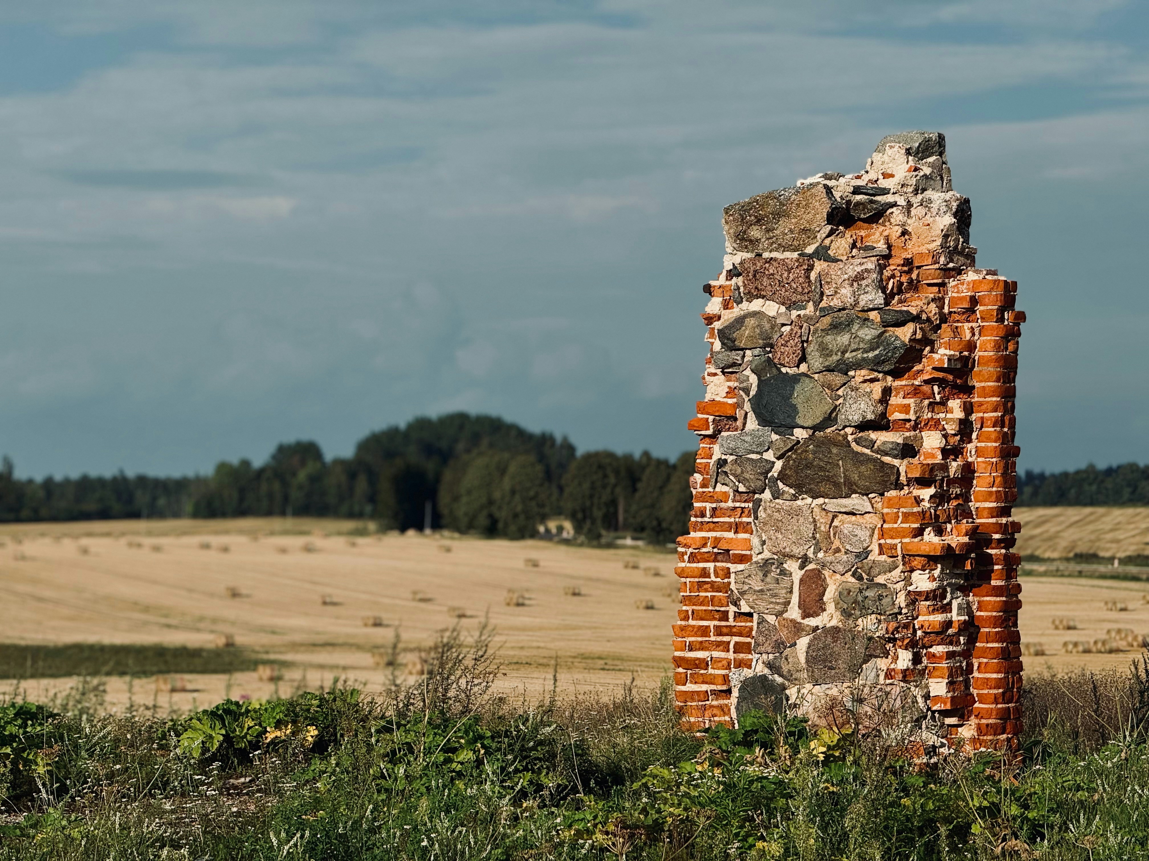 The Weathered Pillar: Brick-Stone Ruin Anchoring a Quiet Prairie