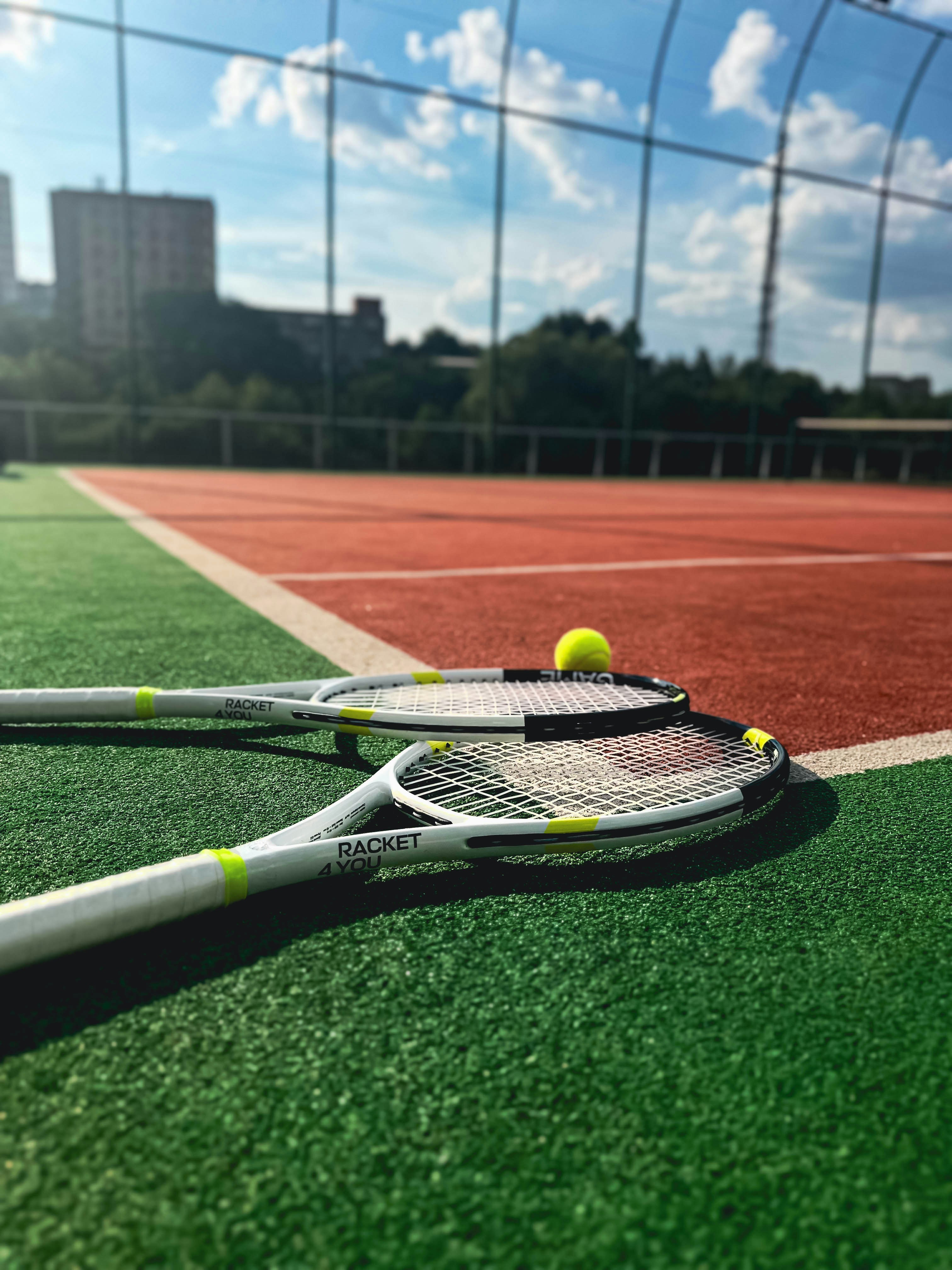 A tennis racket and ball on a tennis court photo – Free Tennis court ...