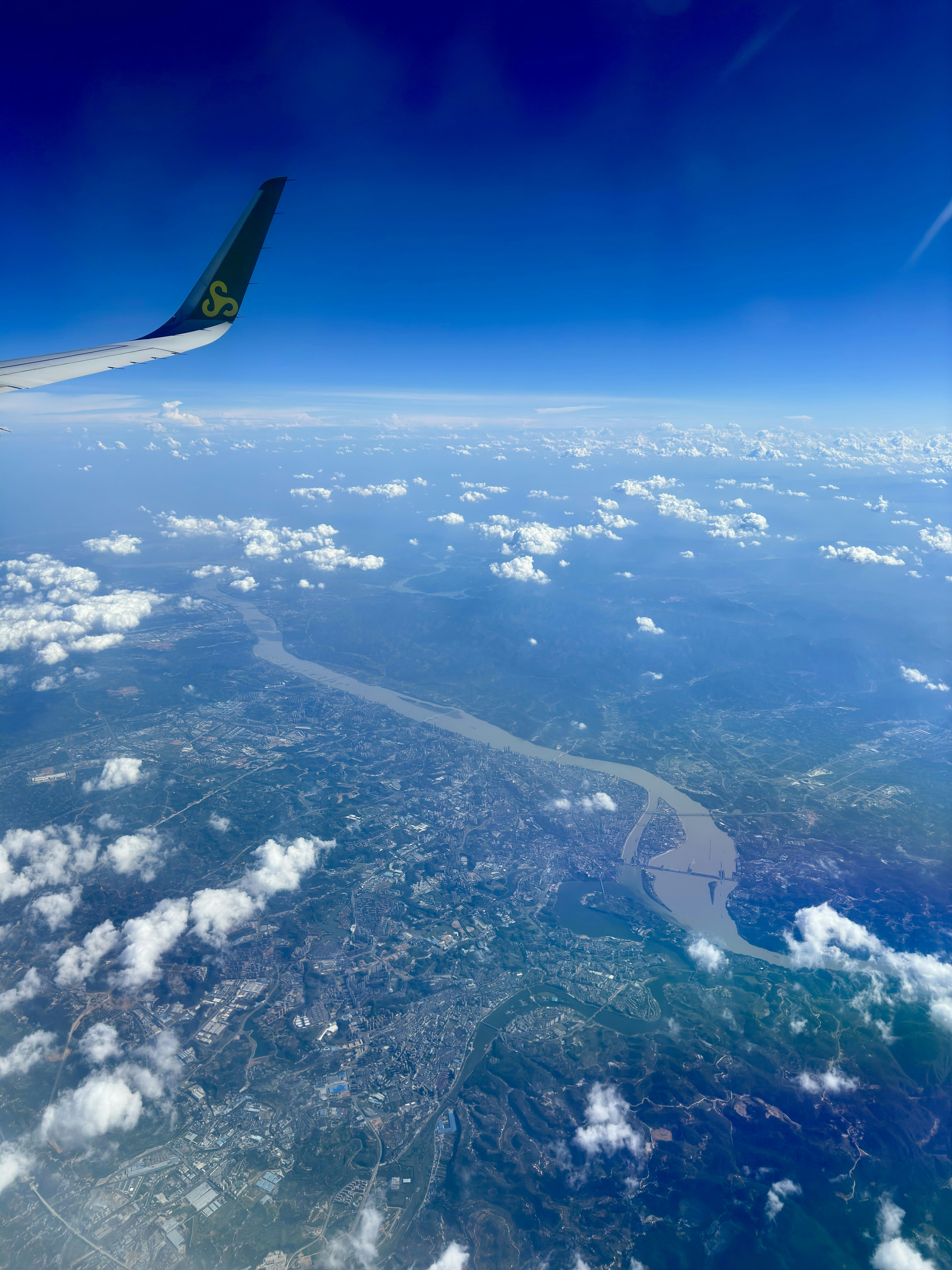 Skyward Glimpse: Cityscape and River from Above