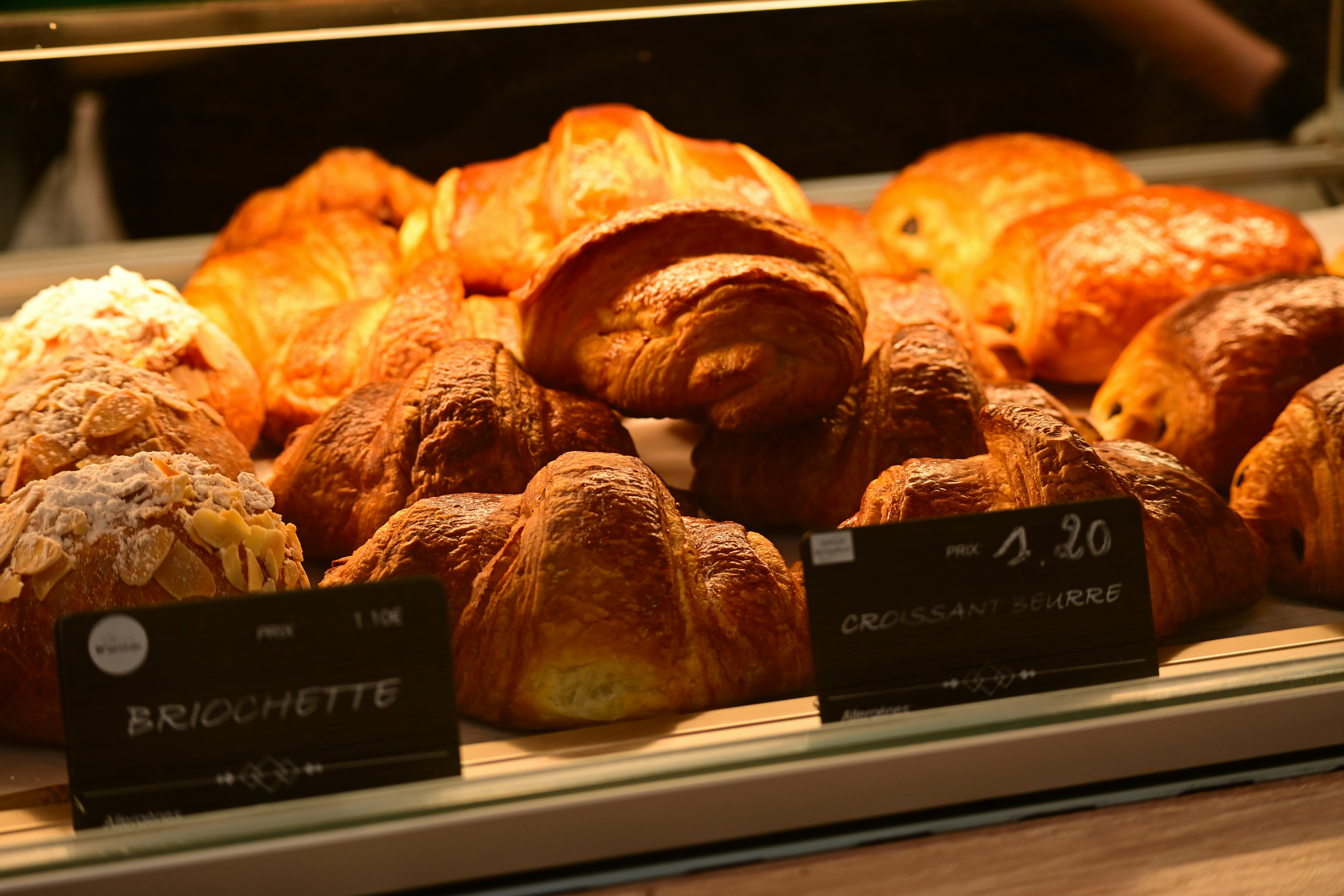 A display case filled with lots of baked goods photo – Free Bakery ...