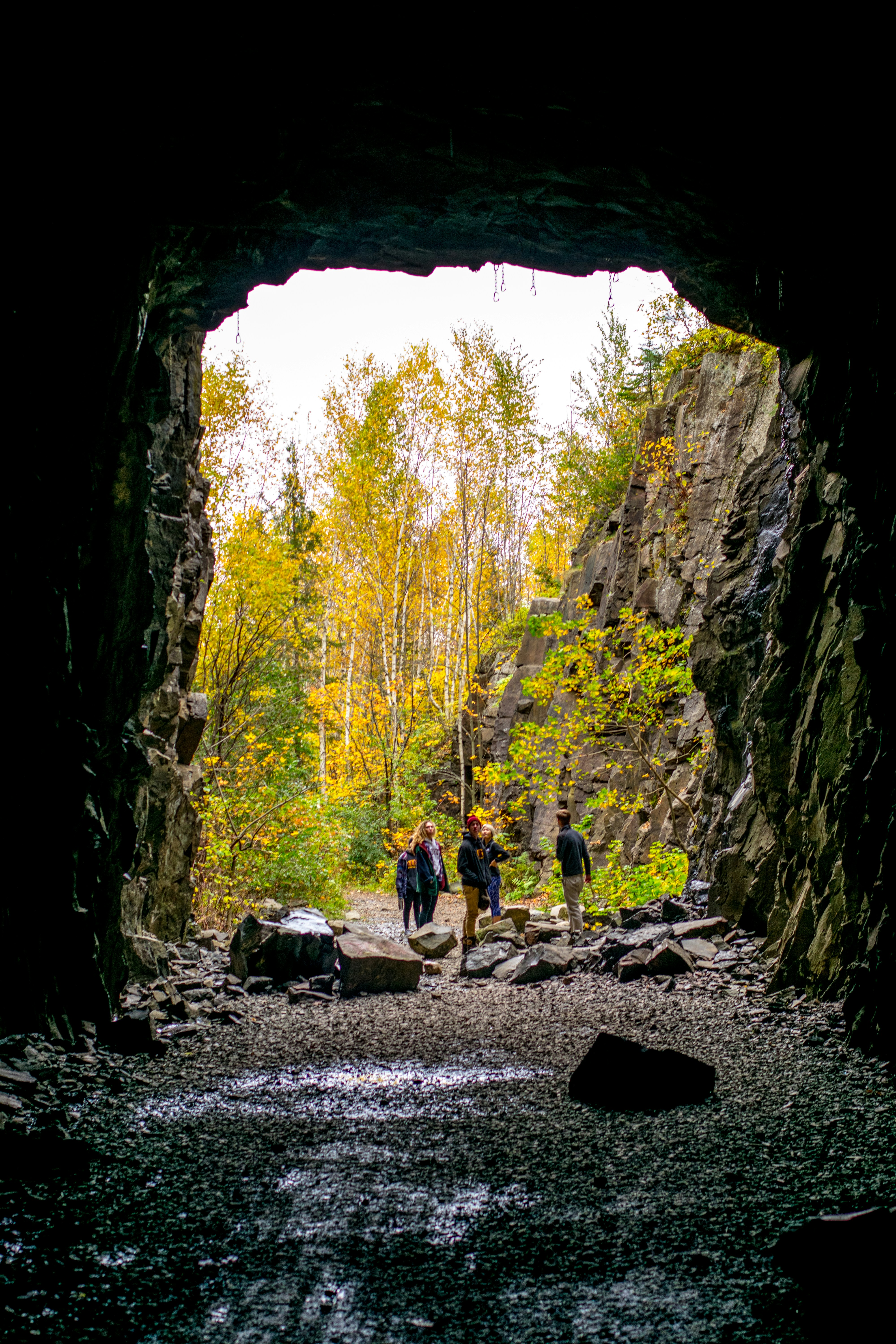 A group of people walking through a cave photo – Free Duluth Image on ...