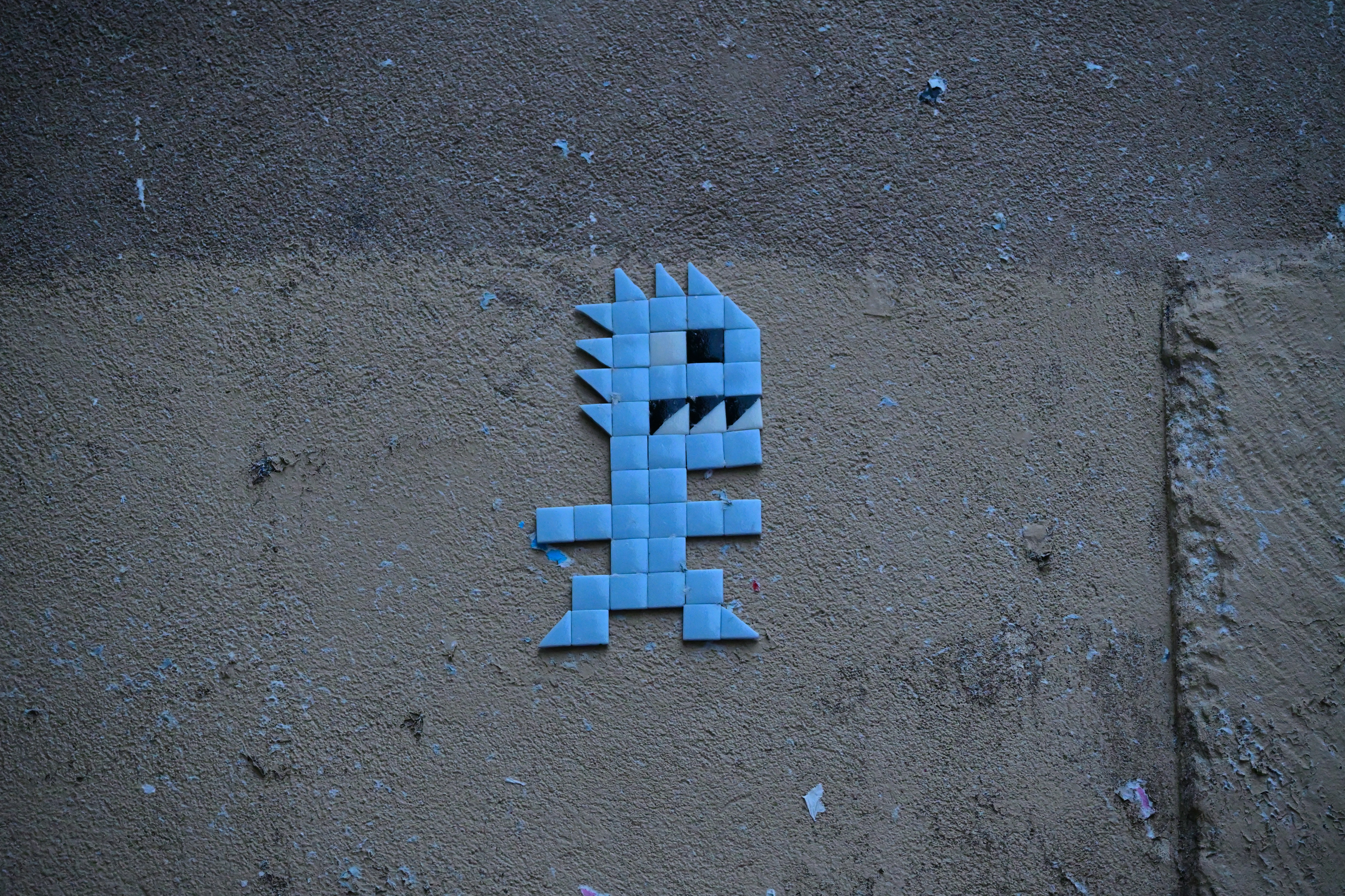 Azure Pixel-Hero on a Weathered Brick Canvas