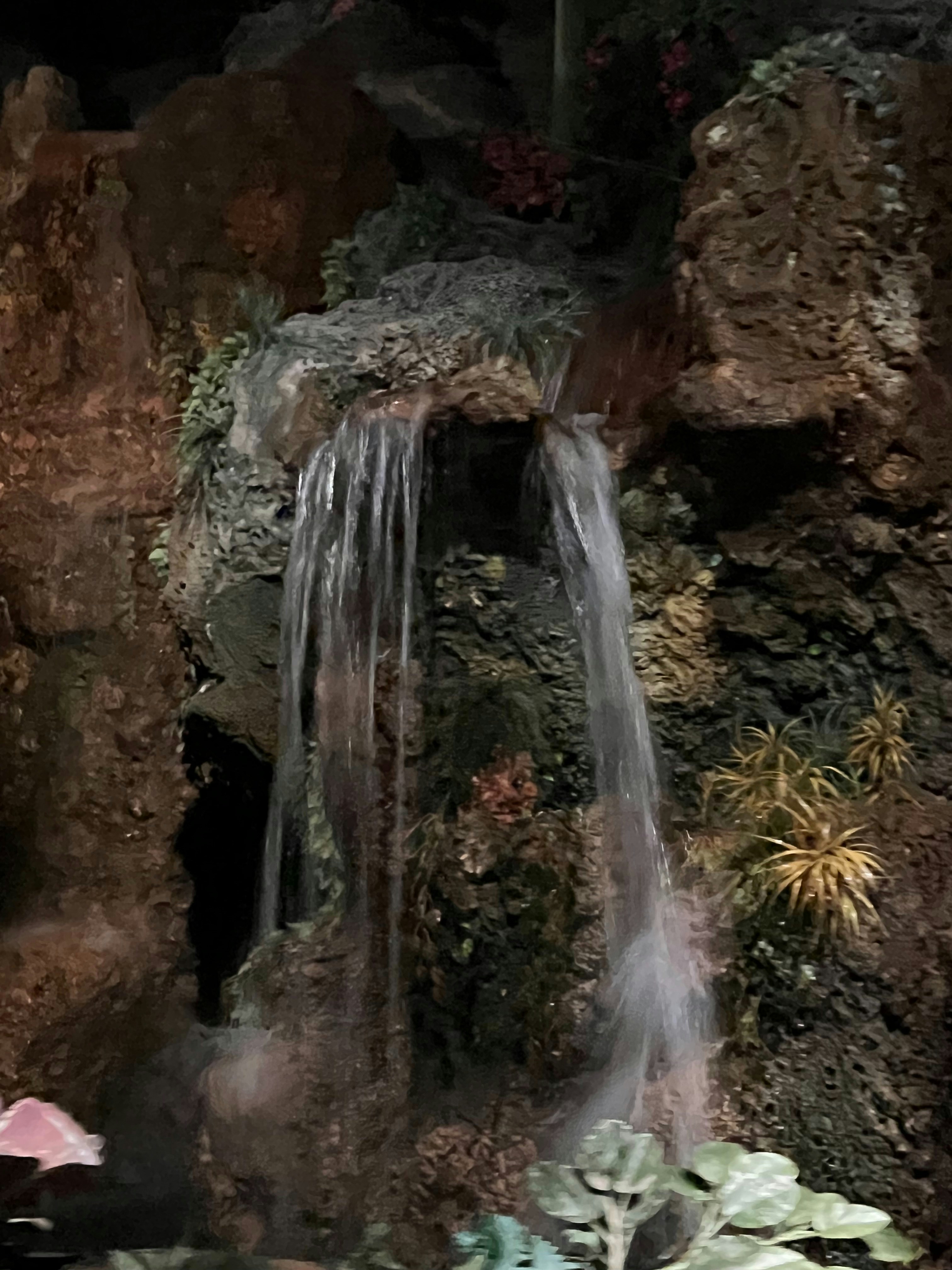 Midnight Cascade: A Quiet Waterfall Between Rugged Rocks