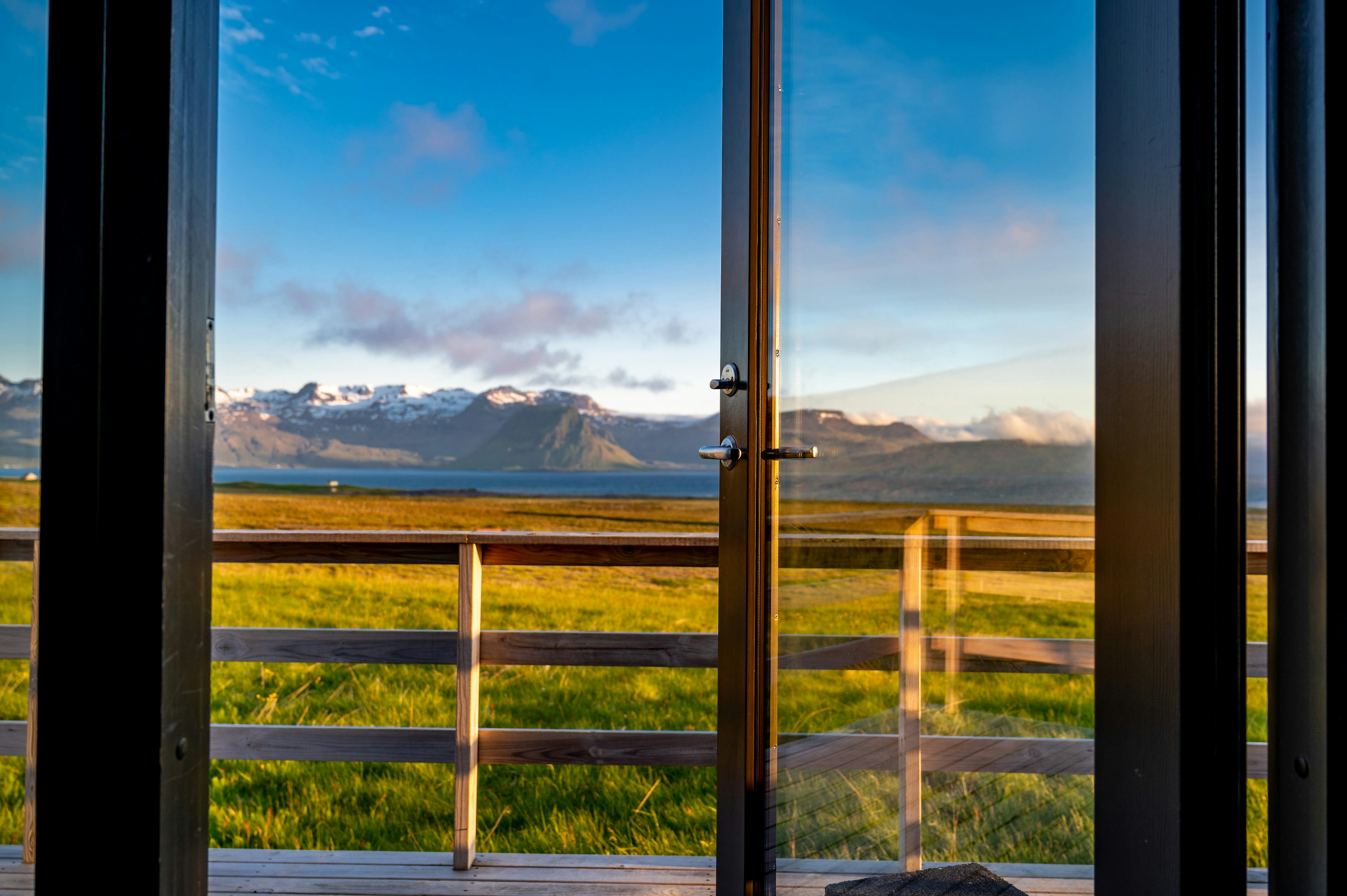Threshold Vista: Alpine Ridge Framed by Glass Doors