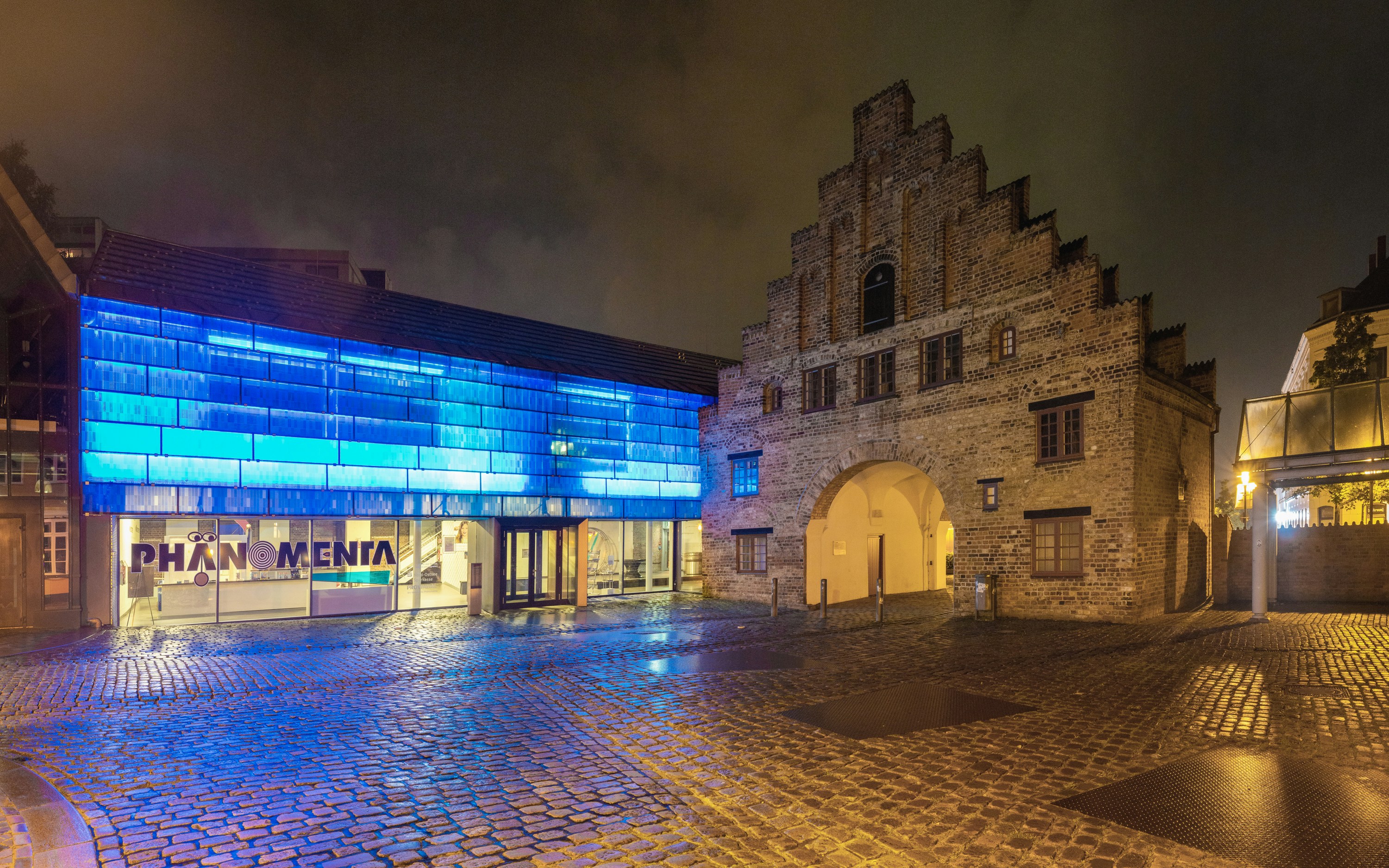 A large building with a blue light on it's side photo – Free Flensburg ...