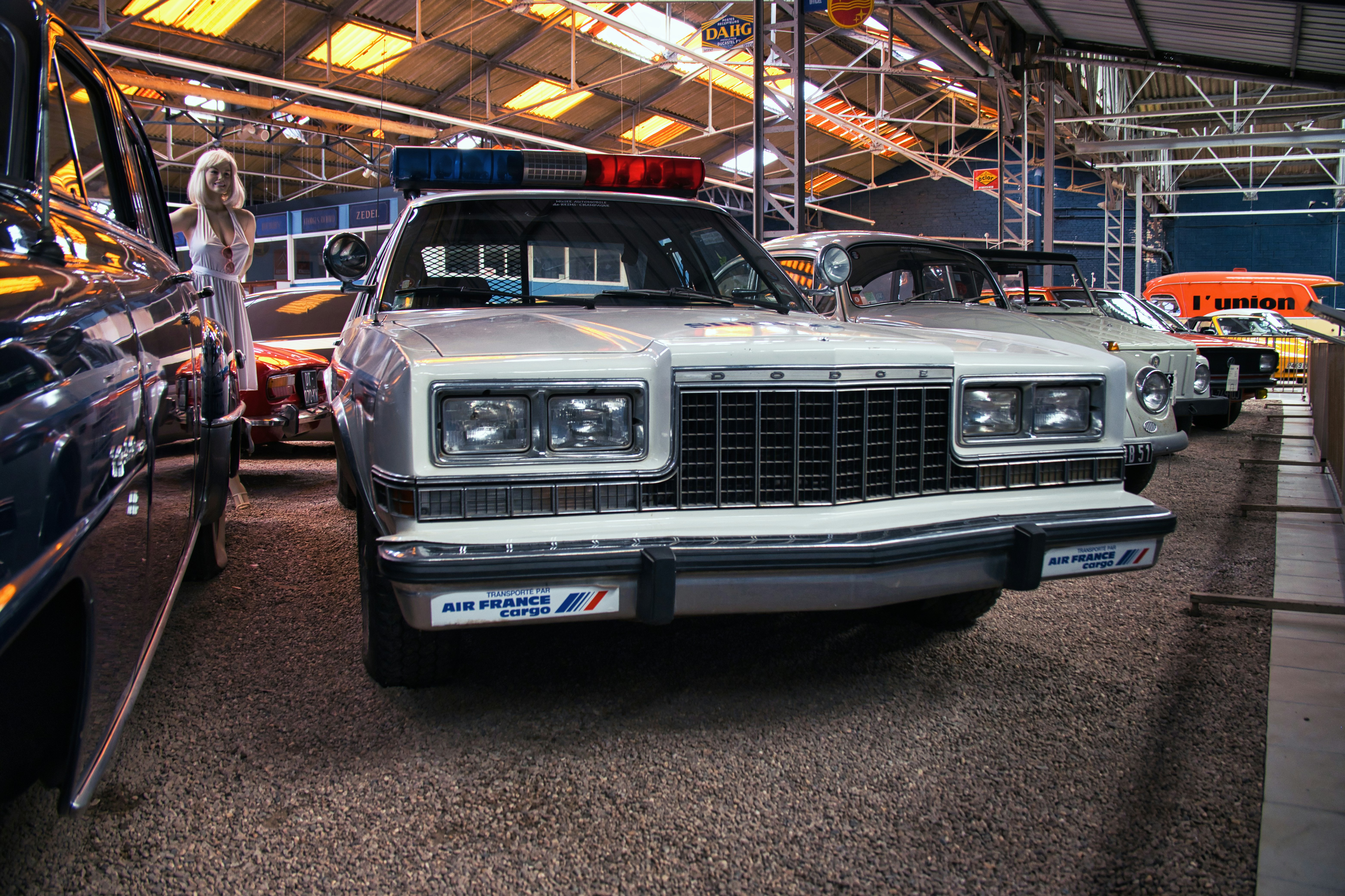 Front-and-Center: A Classic Police Cruiser Guarding the Car Show