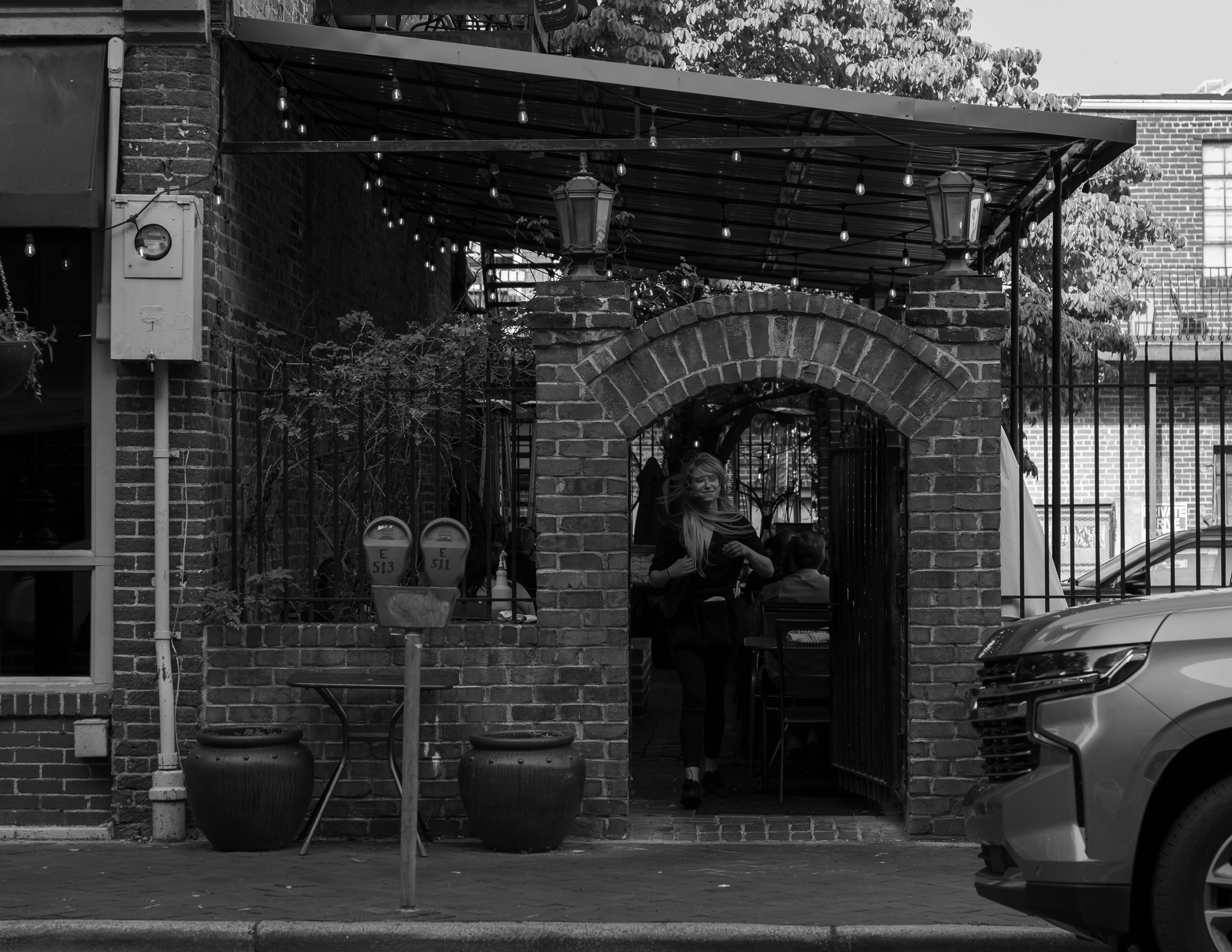 Brick-Arch Café at Dusk: Quiet Light Through the Gateway