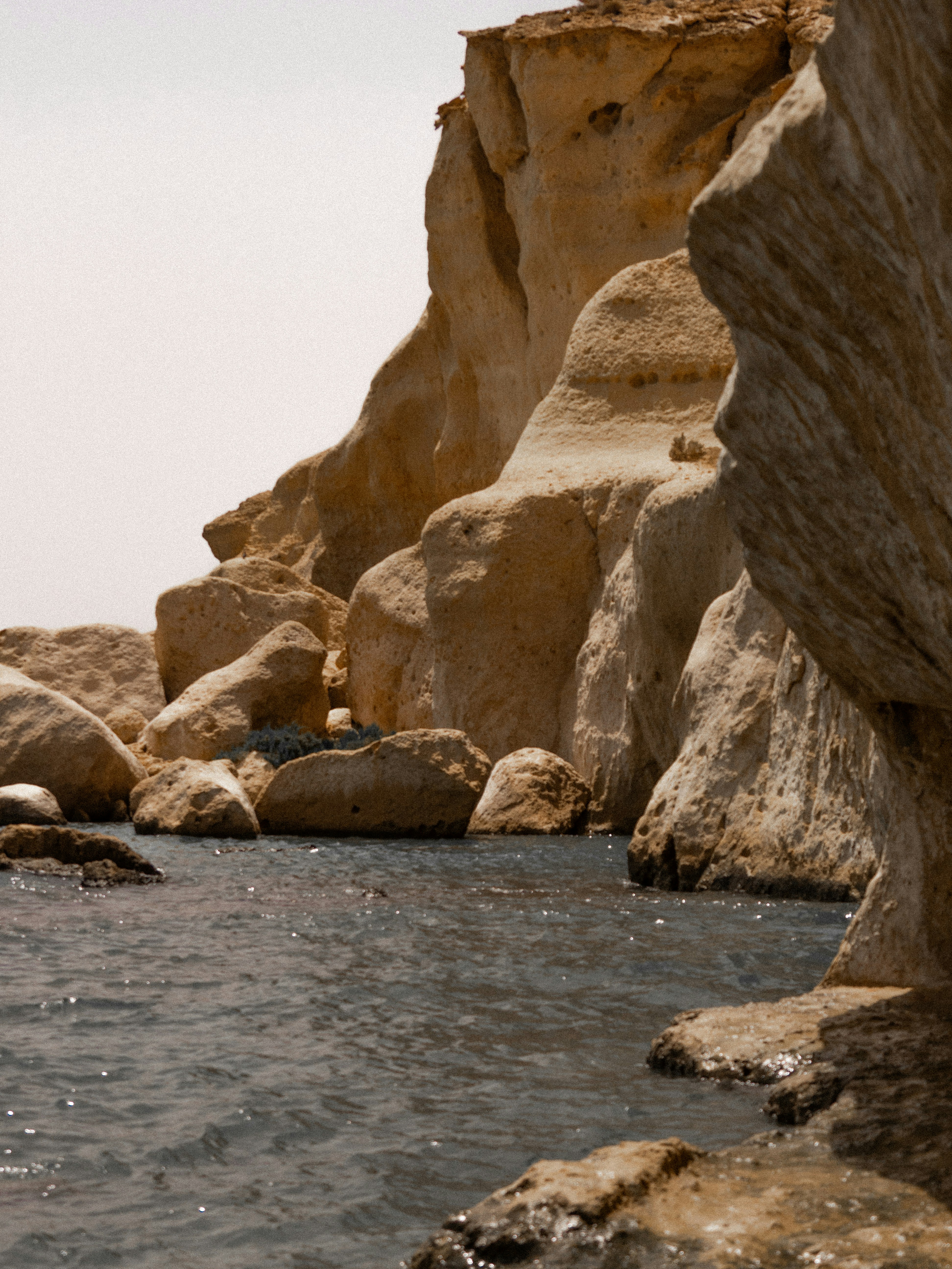Sun-bleached Limestone Sentinels Over a Quiet Cove