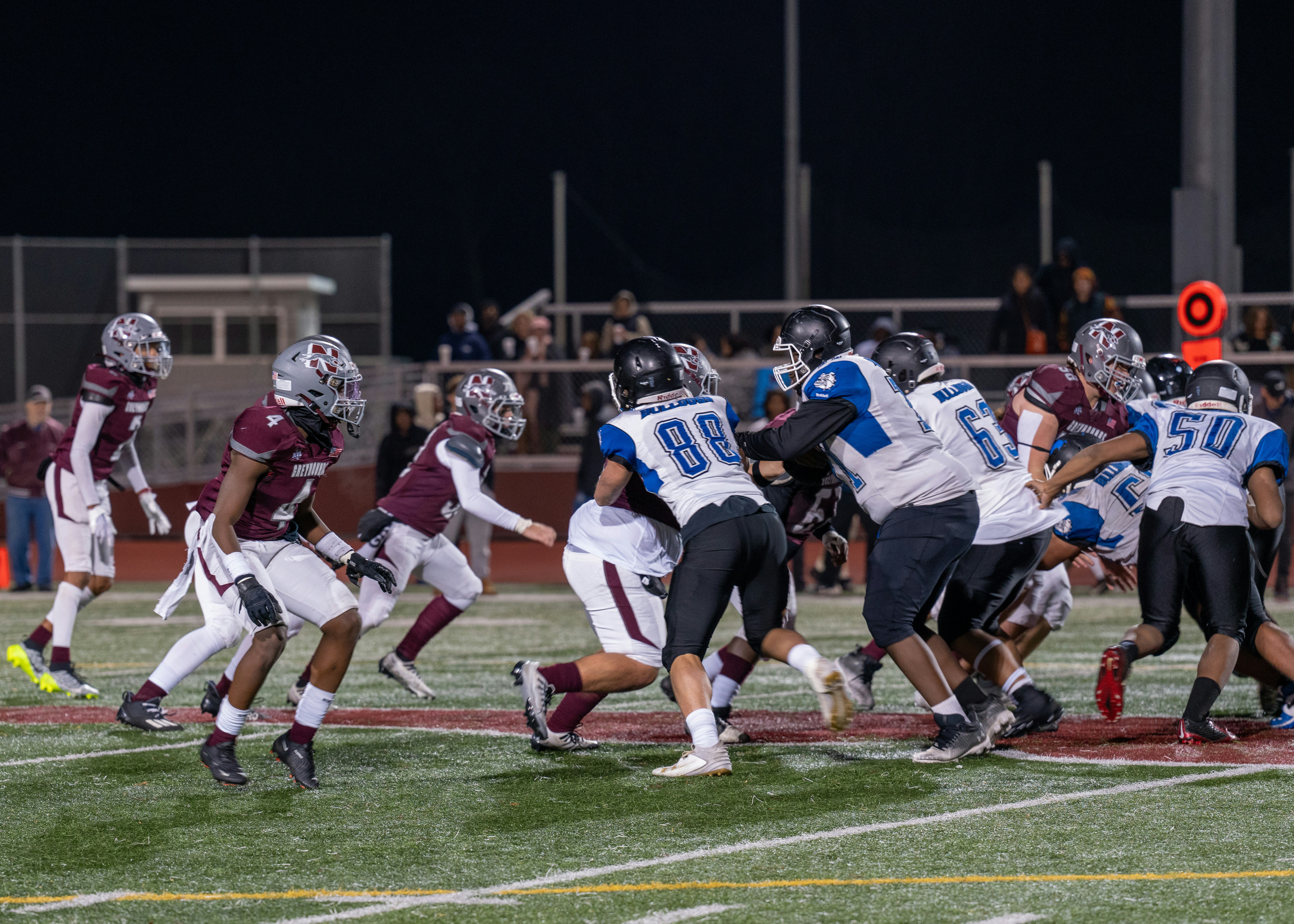 A football game is being played on the field photo – Free Naugatuck ...