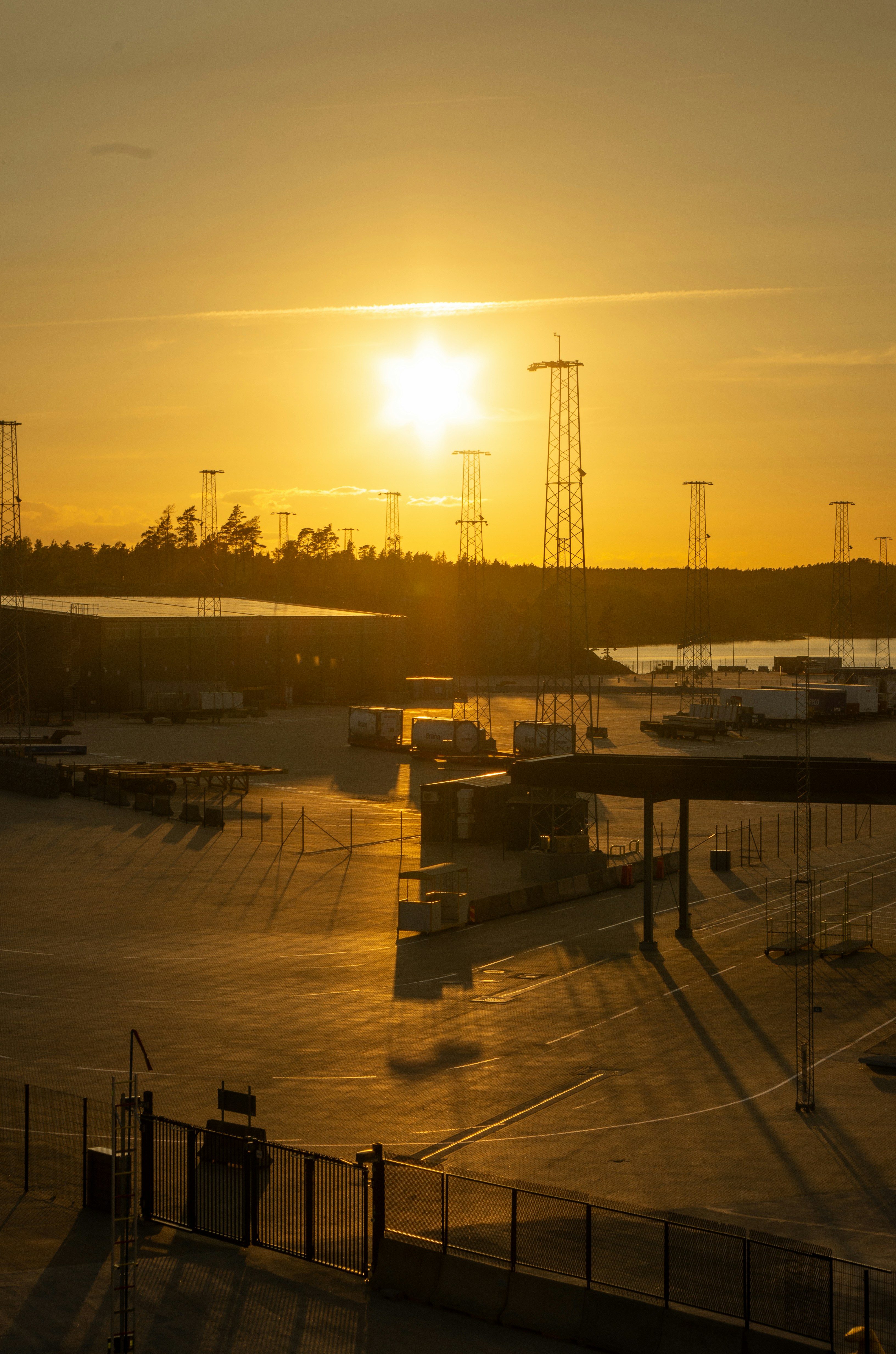 Gilded Runway: Sunset Over a Silent Airport Tarmac