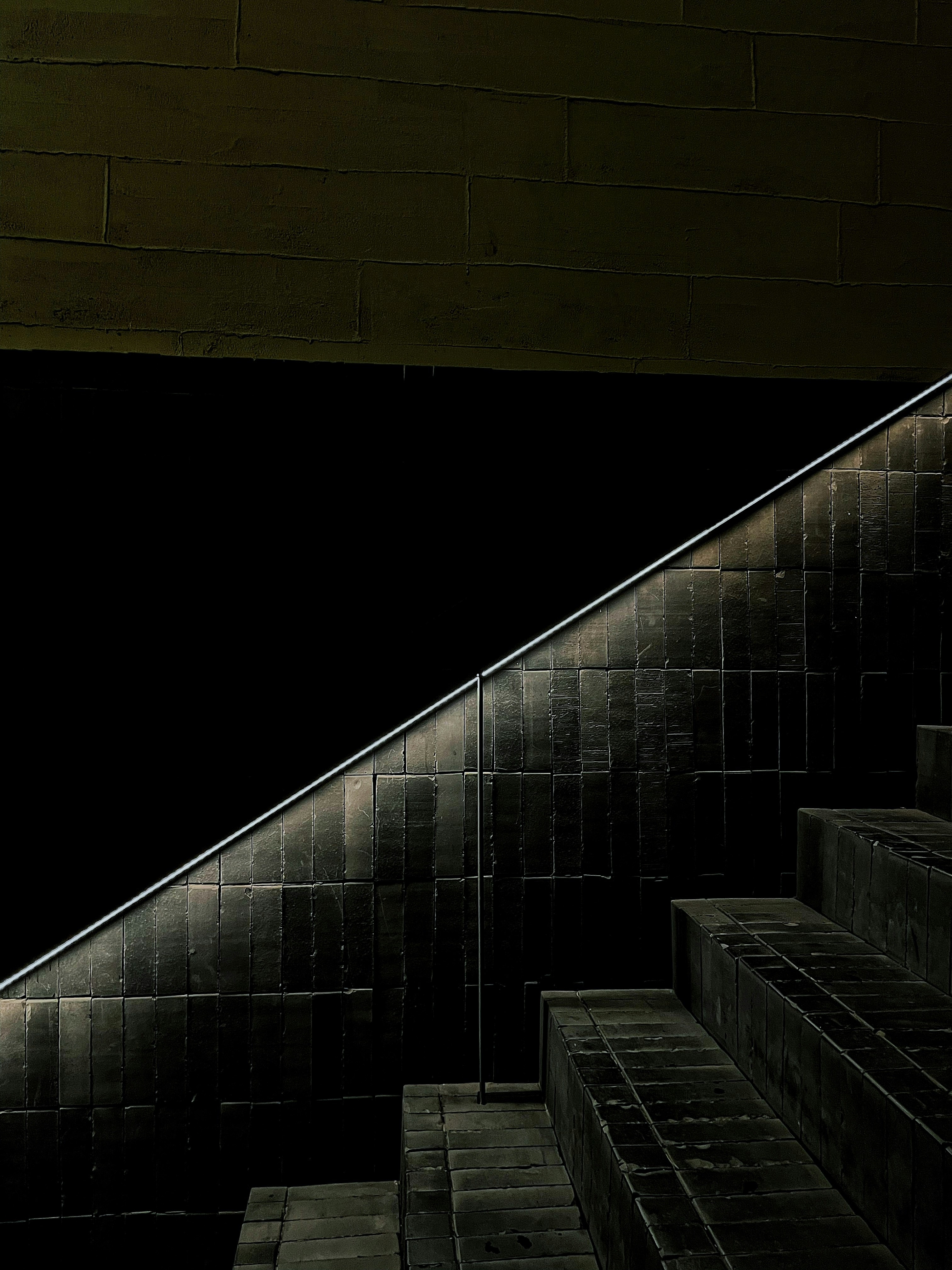 A man riding a skateboard down a set of stairs photo – Free Banister ...