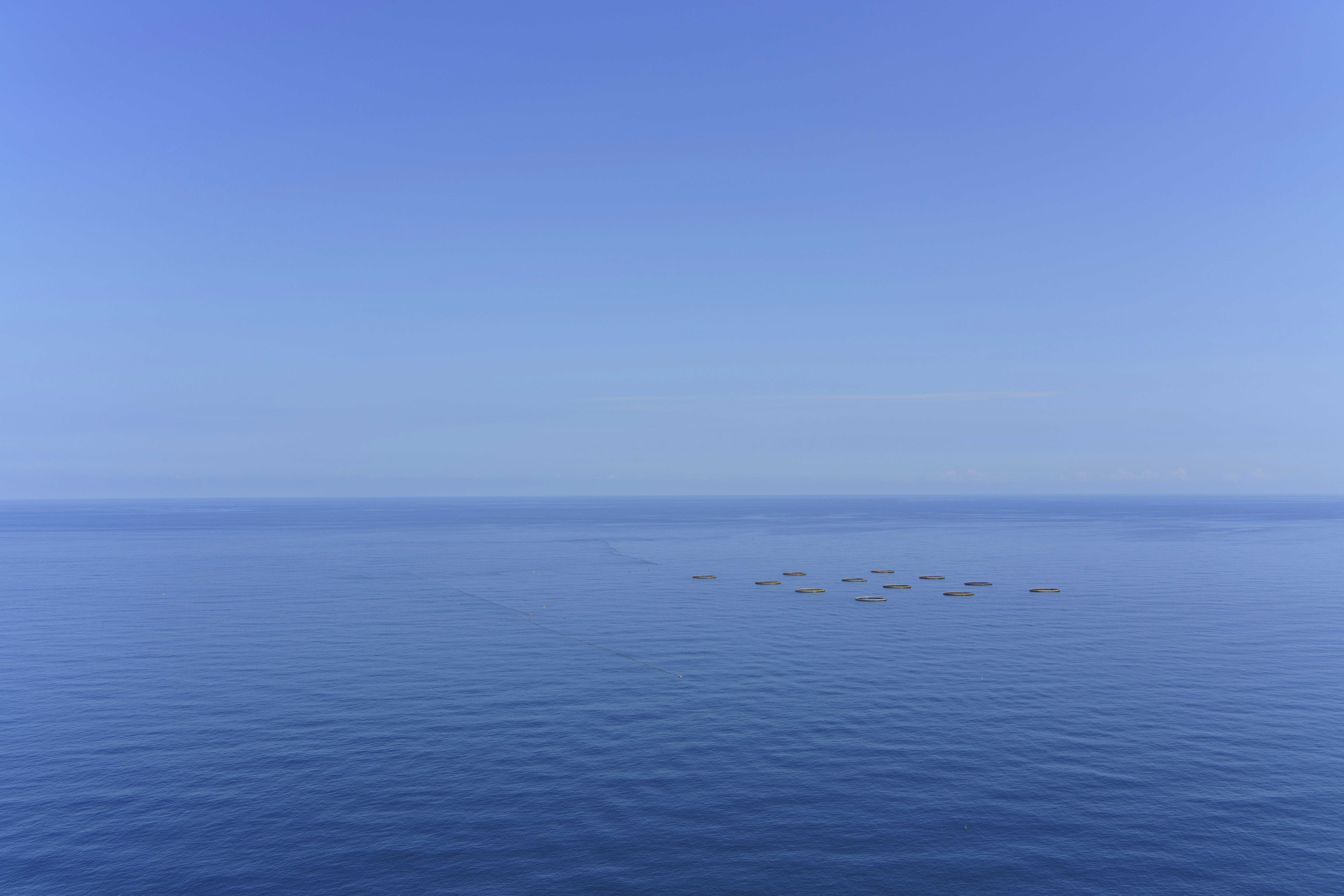 A large body of water with a sky background