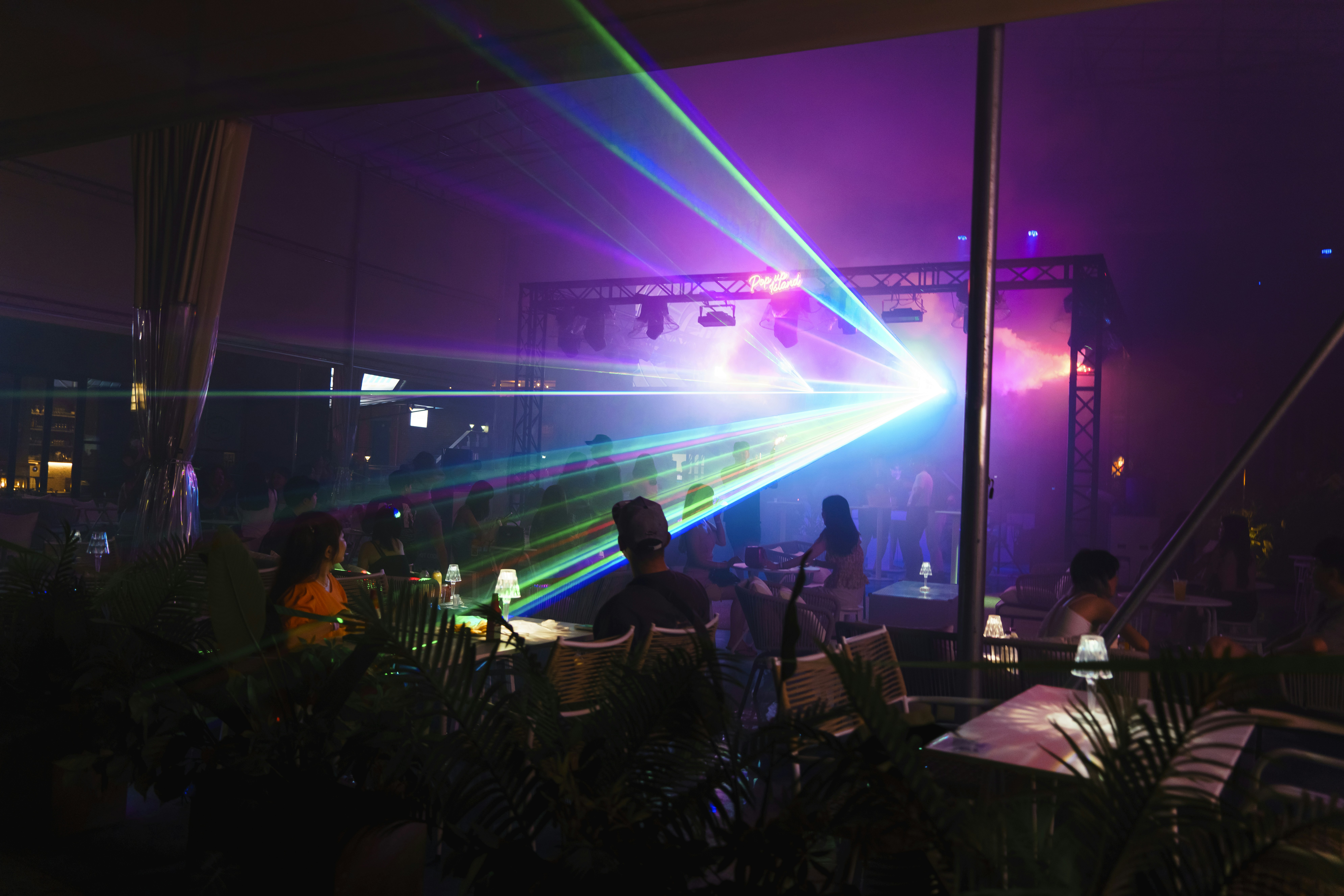 A group of people standing on top of a stage photo – Free Night club ...