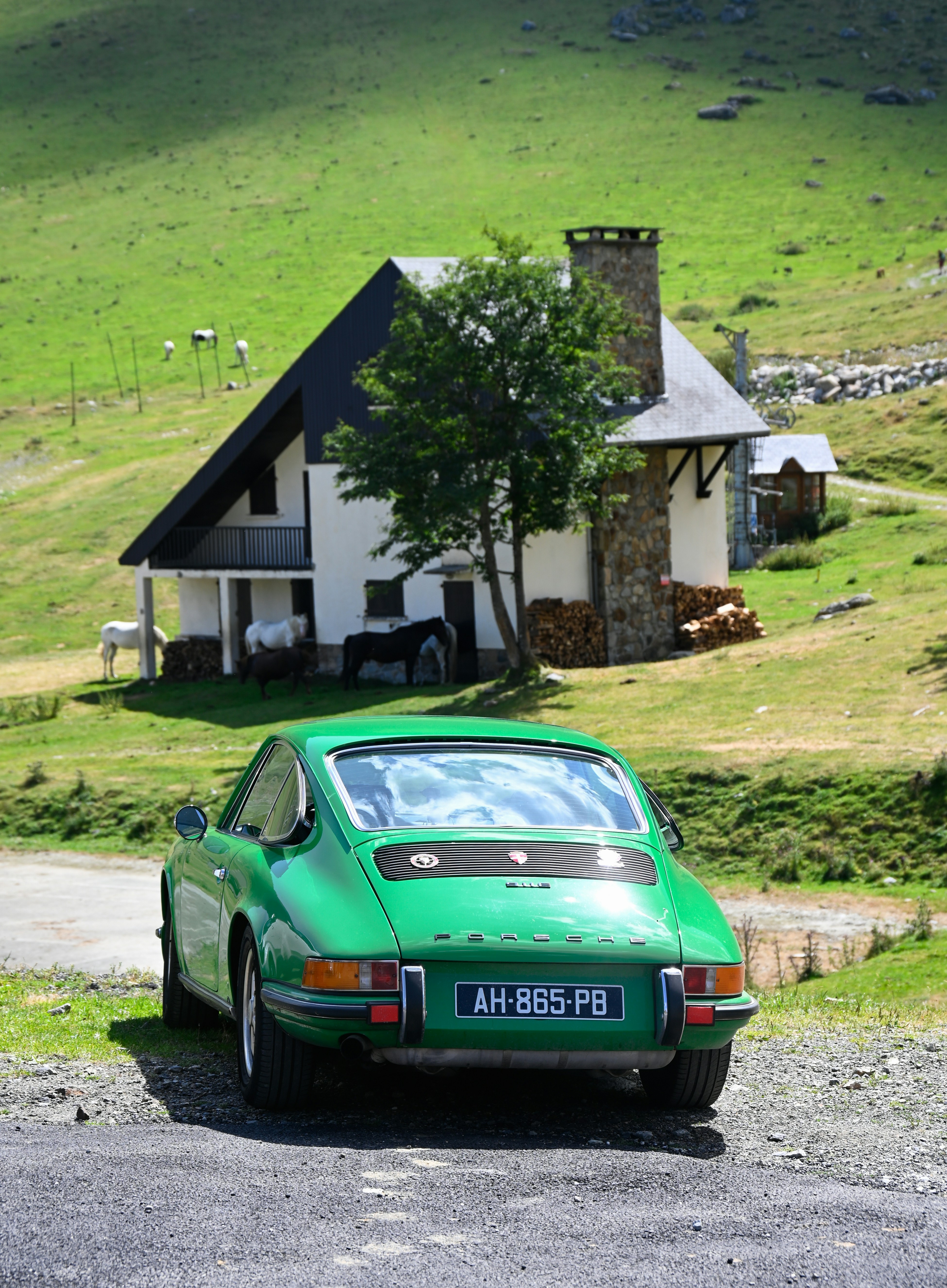 Alpine Green Porsche Anchors a Quiet Farmyard Scene