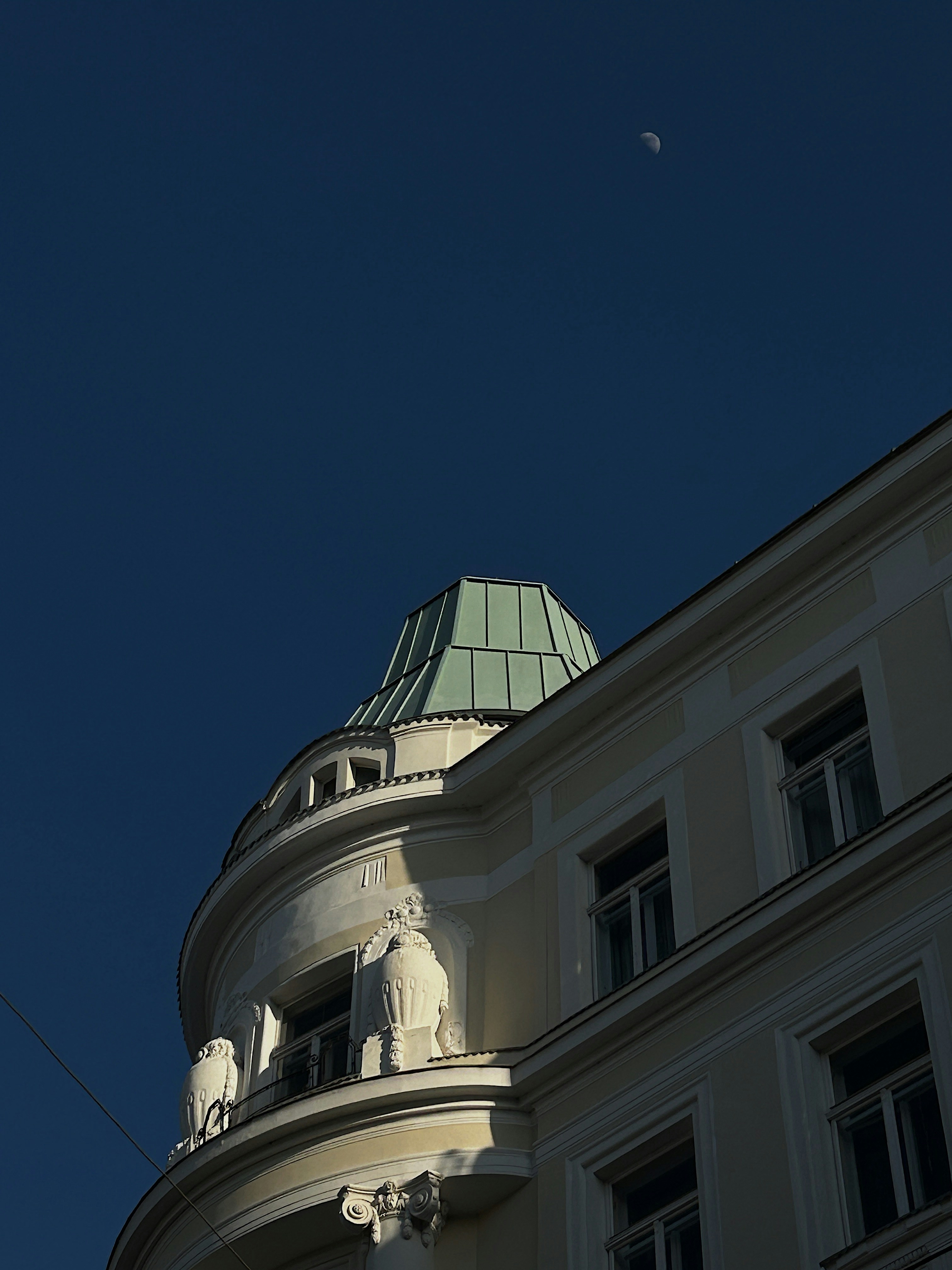 Copper-Domed Corner: Sunlit Neoclassical Facade