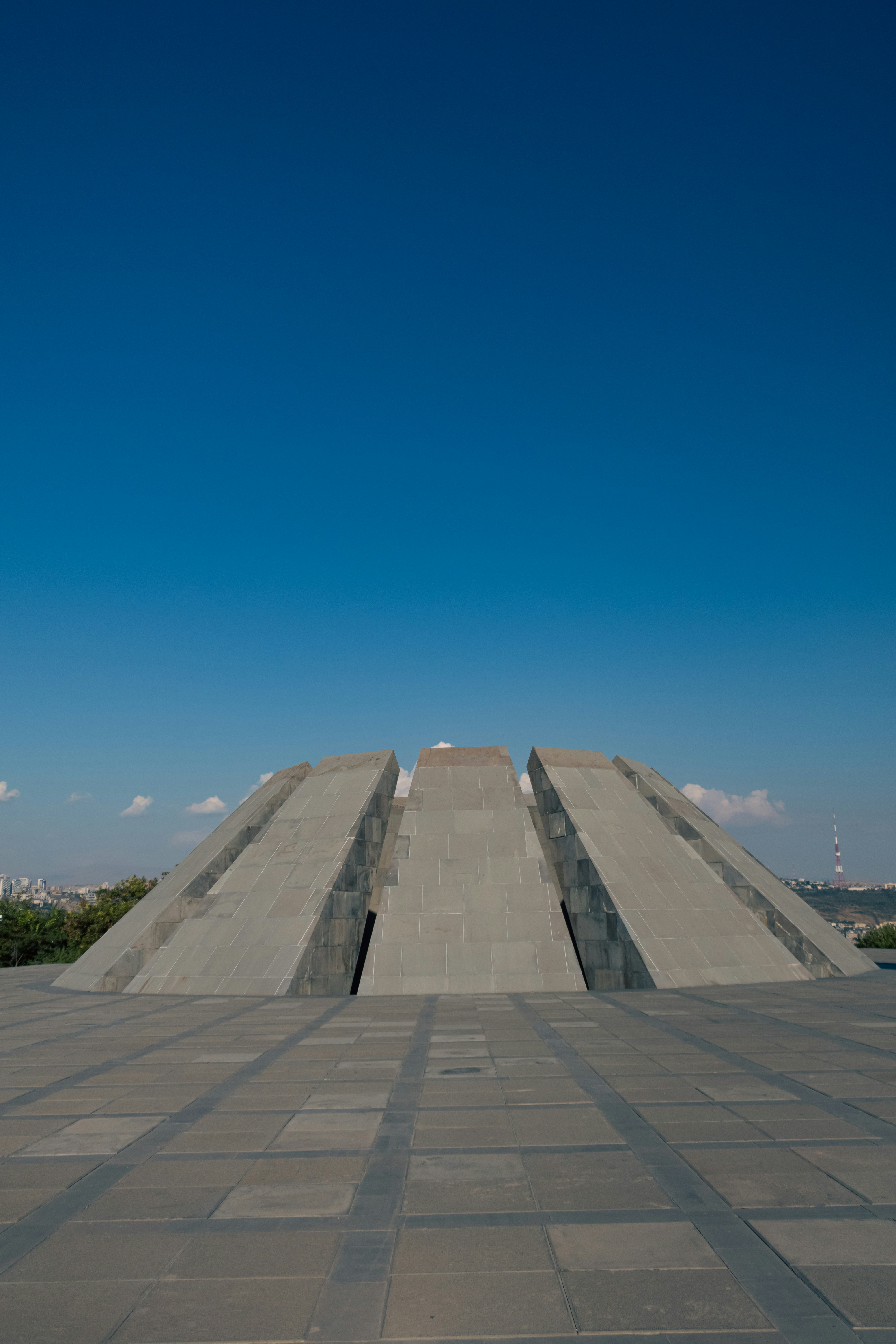Central Ziggurat Echo: Concrete Ramps Reaching the Cerulean Sky