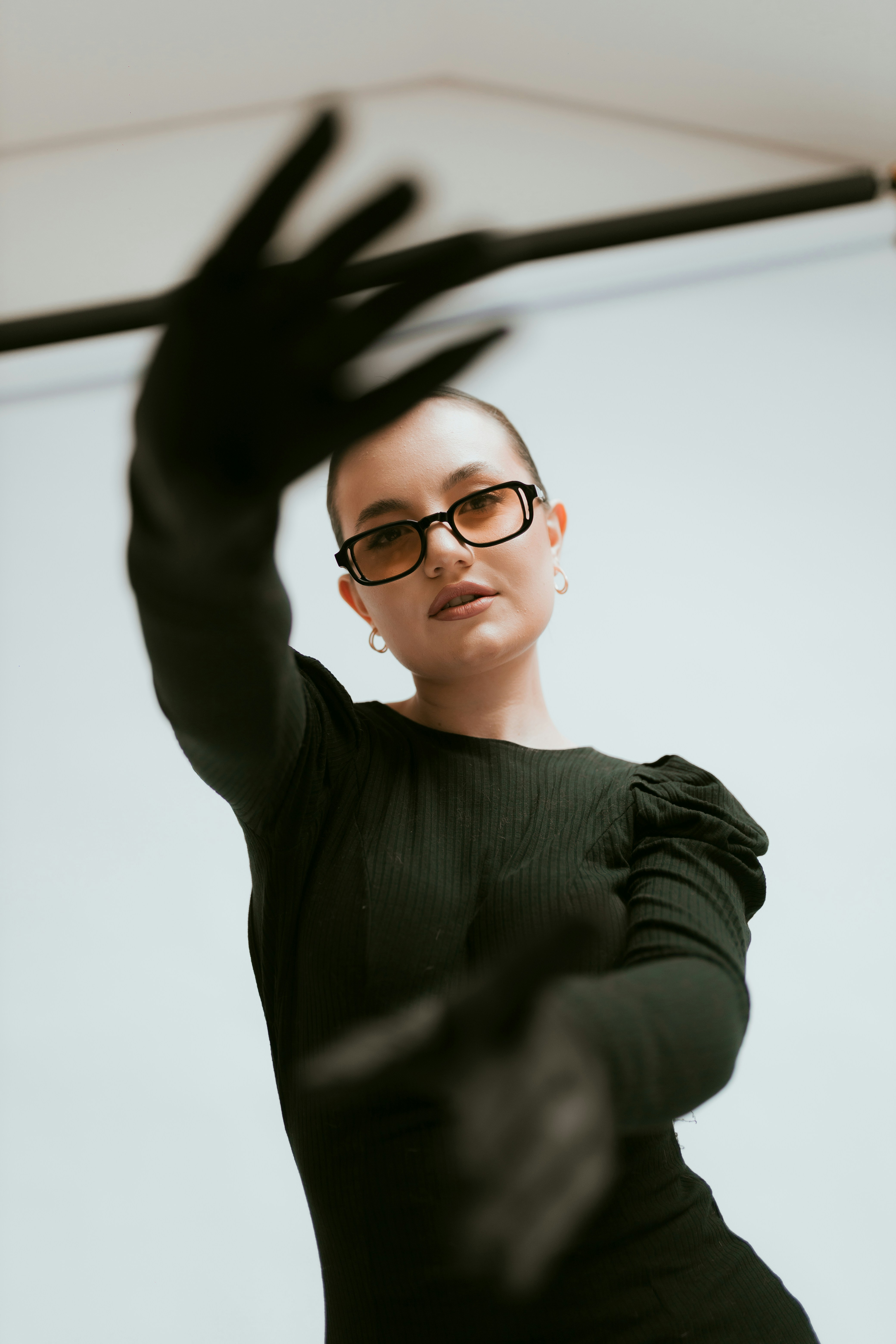 Gloved Hands Reach Forward: A Portrait in Soft Focus