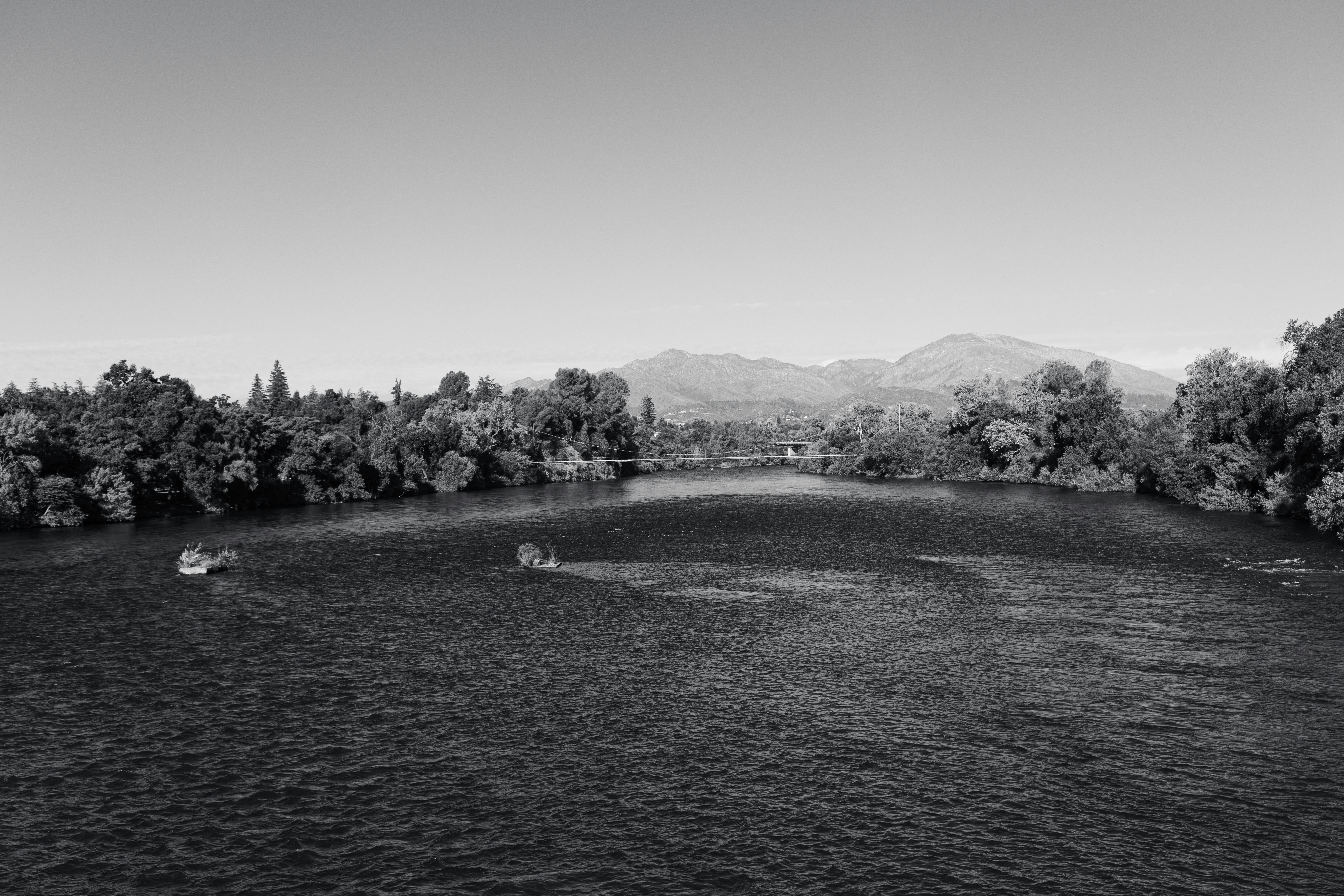 A black and white photo of a body of water