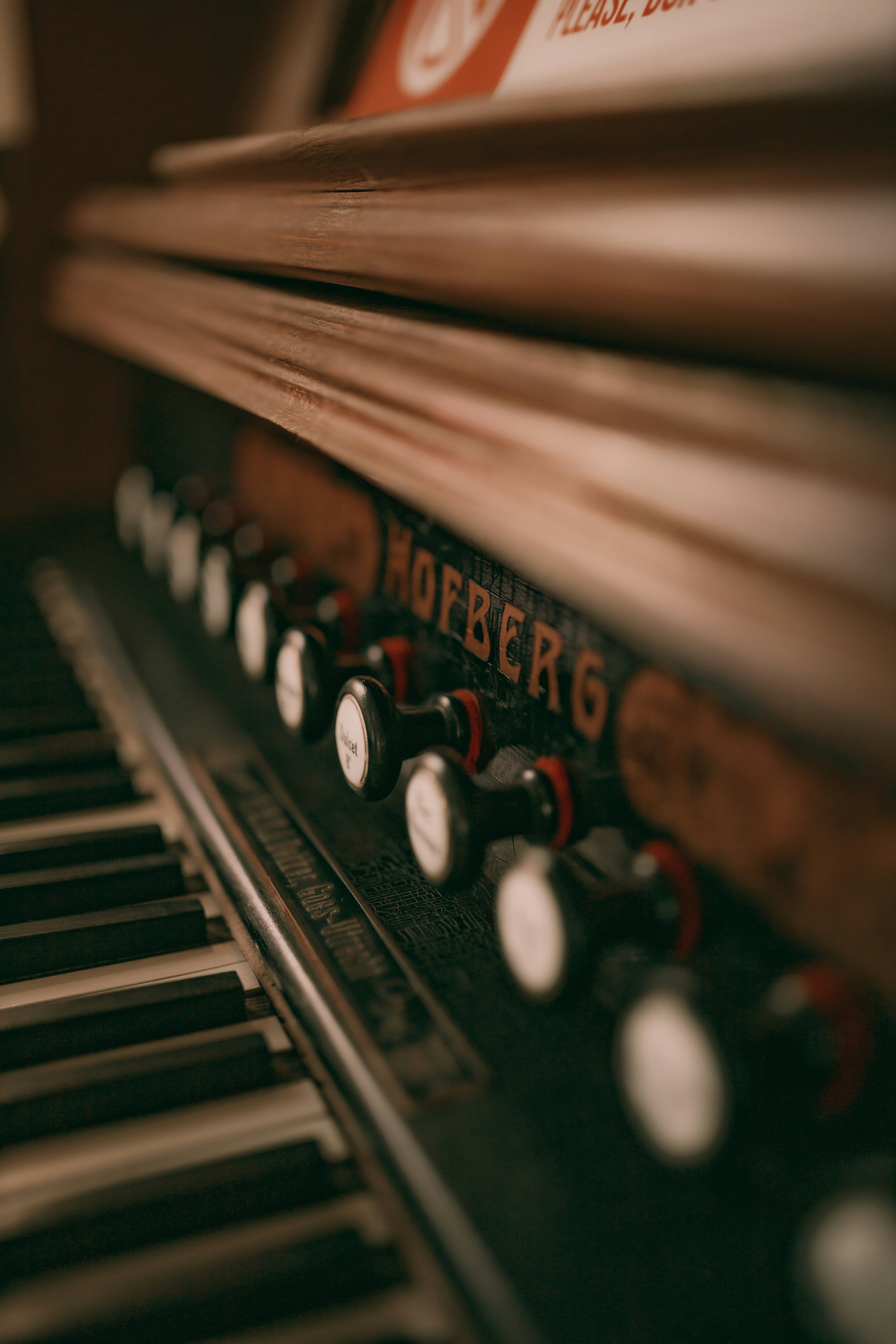Whispering Knobs in Amber Light: A Close-Up of a Vintage Keyboard's Control Panel