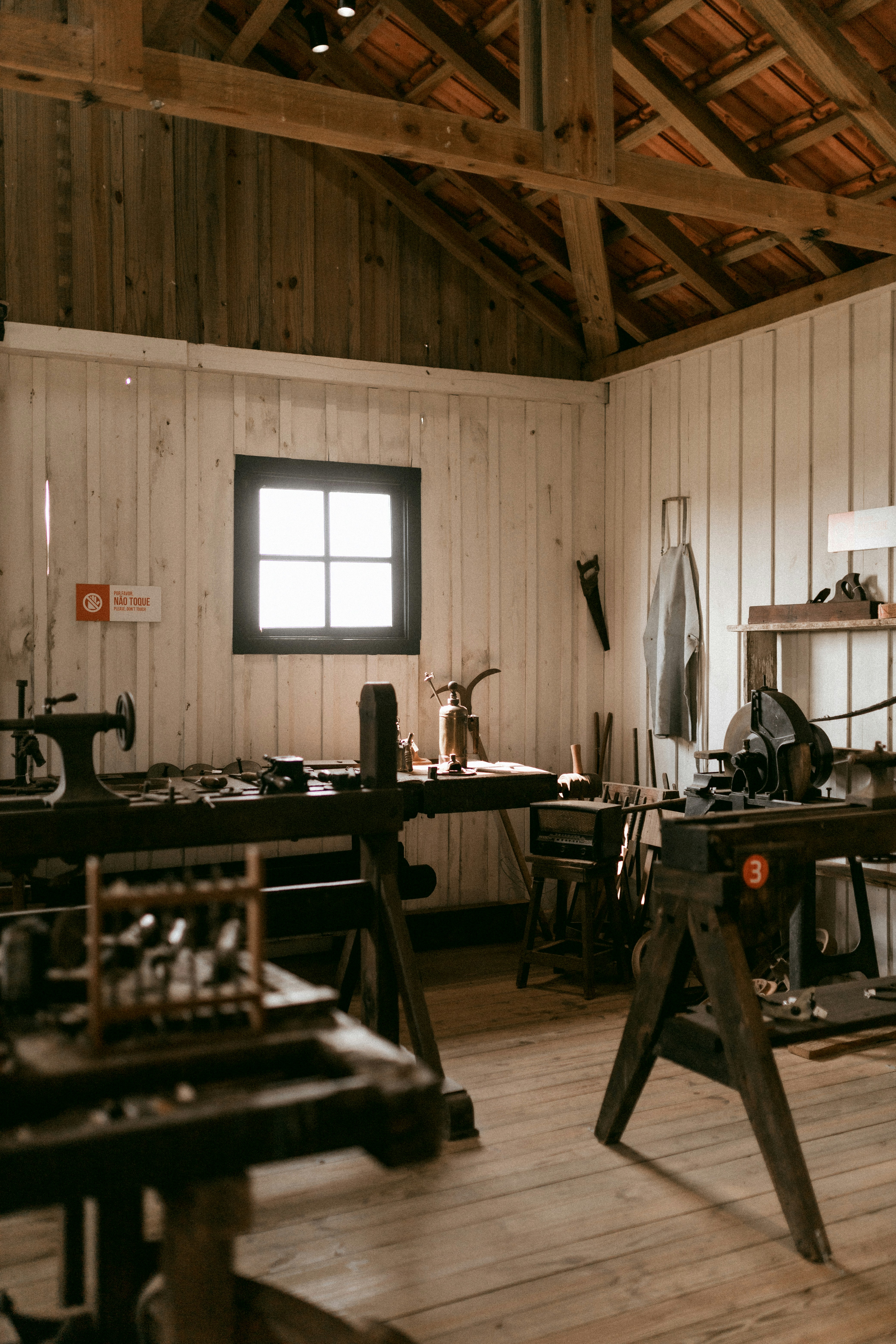 Amber Window, Quiet Woodshop: Time-Tarnished Tools in Wooden Light