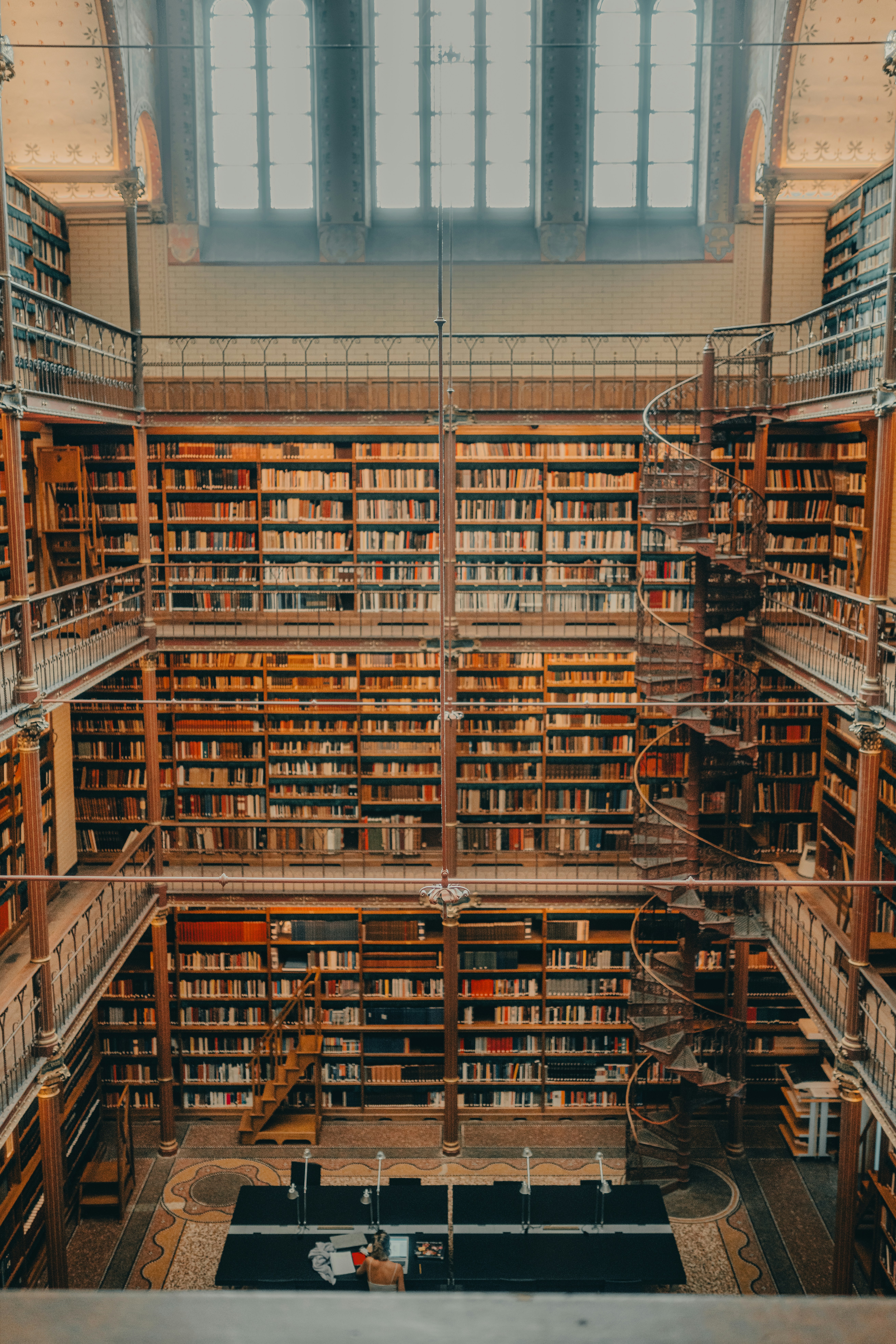 A large library filled with lots of books photo – Free Wallpaper Image ...