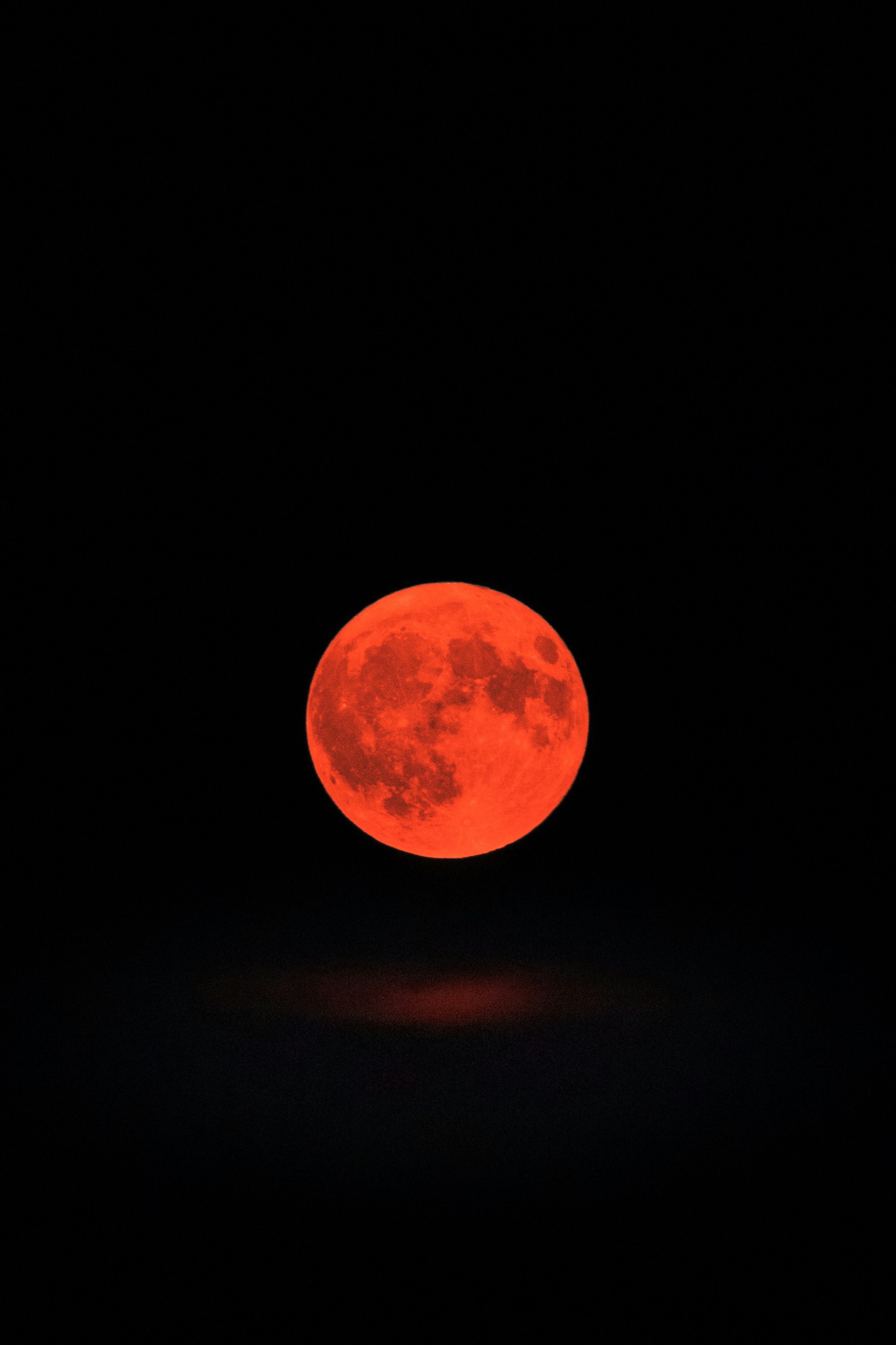 A red moon is seen in the dark sky photo – Free Nature Image on Unsplash